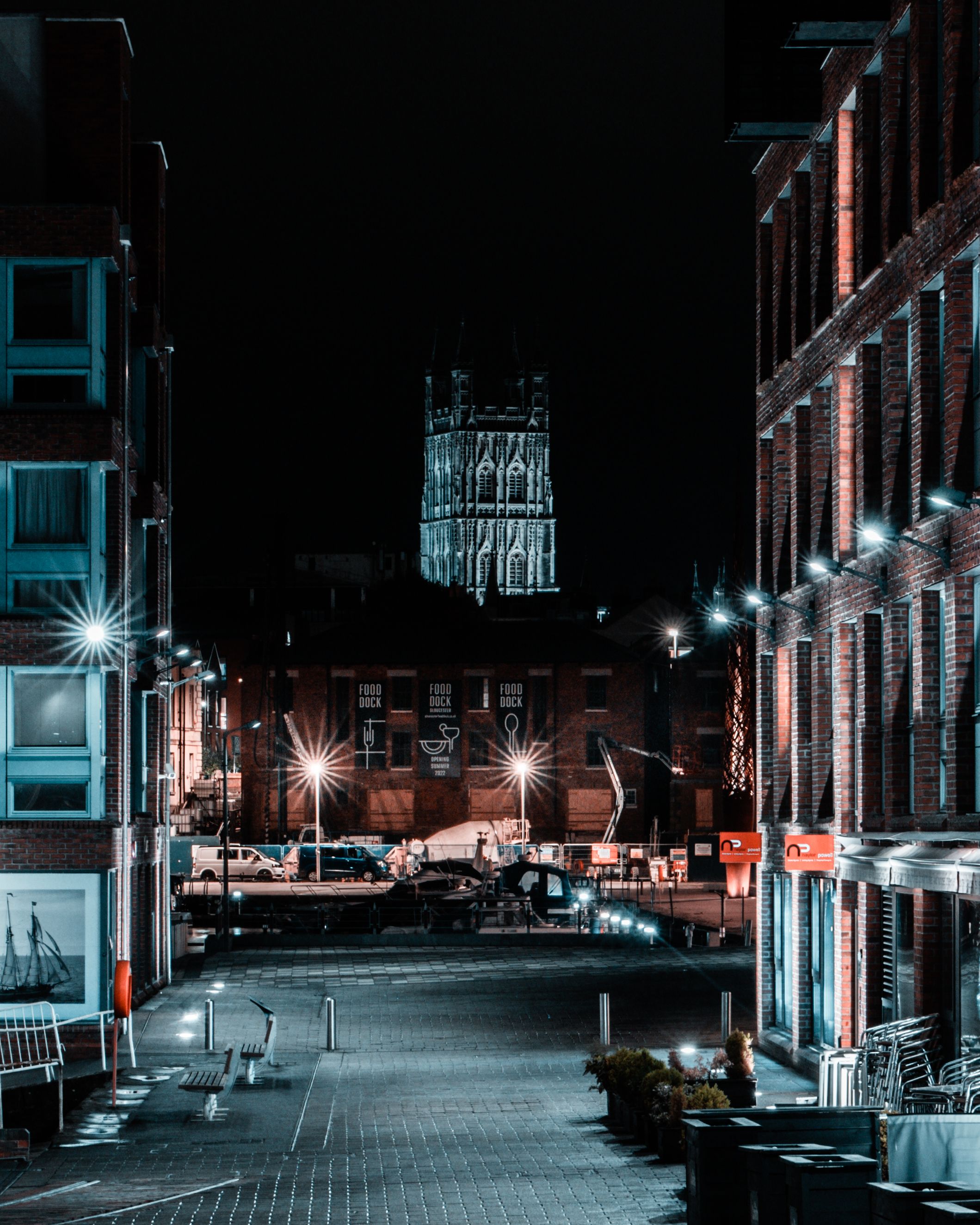A Narrow Alley between Buildings at Night · Free Stock Photo