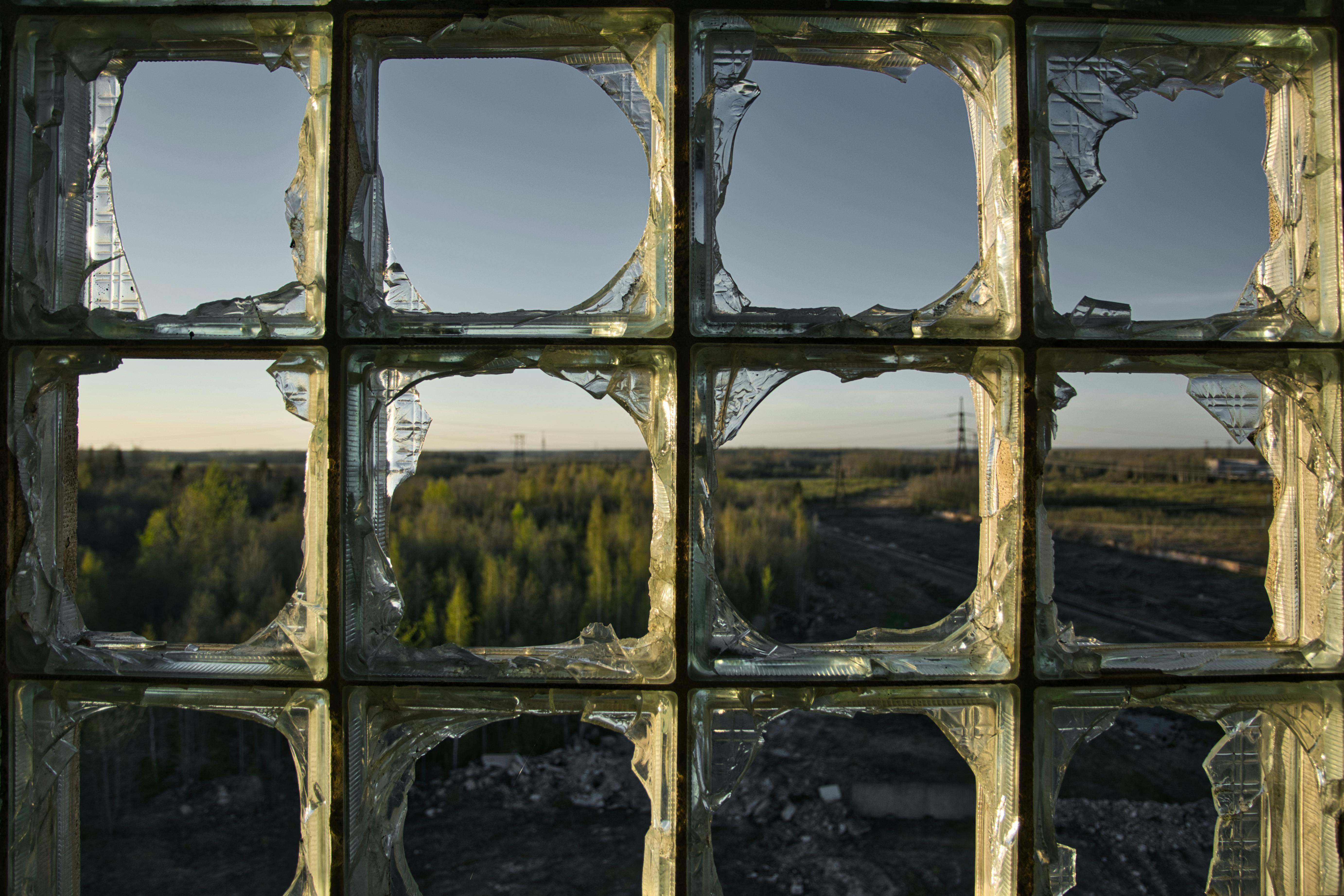 Polaroid Photo of Suburban House Behind Broken Window · Free Stock Photo
