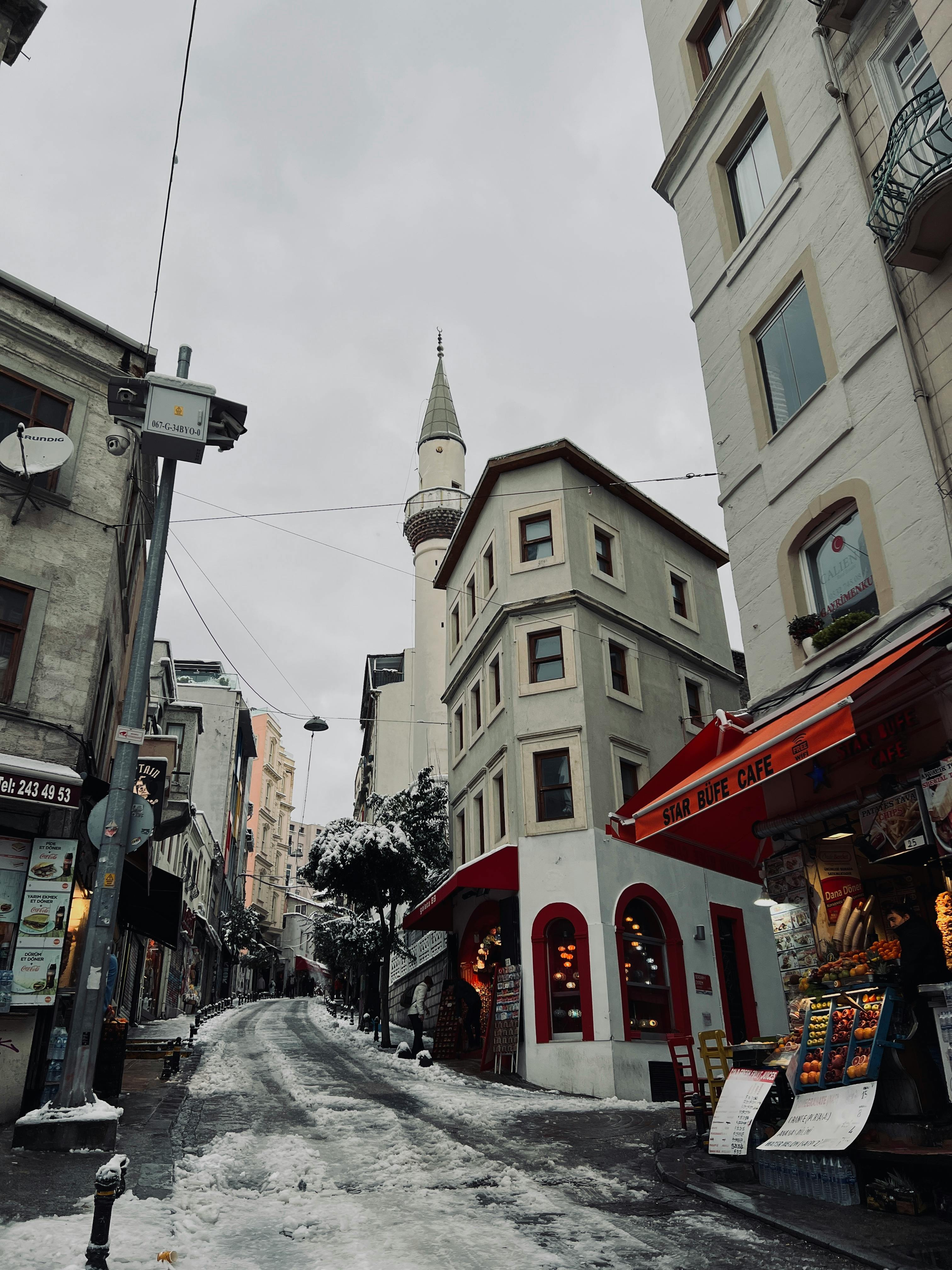 Corner Store Entrance During Snowstorm · Free Stock Photo