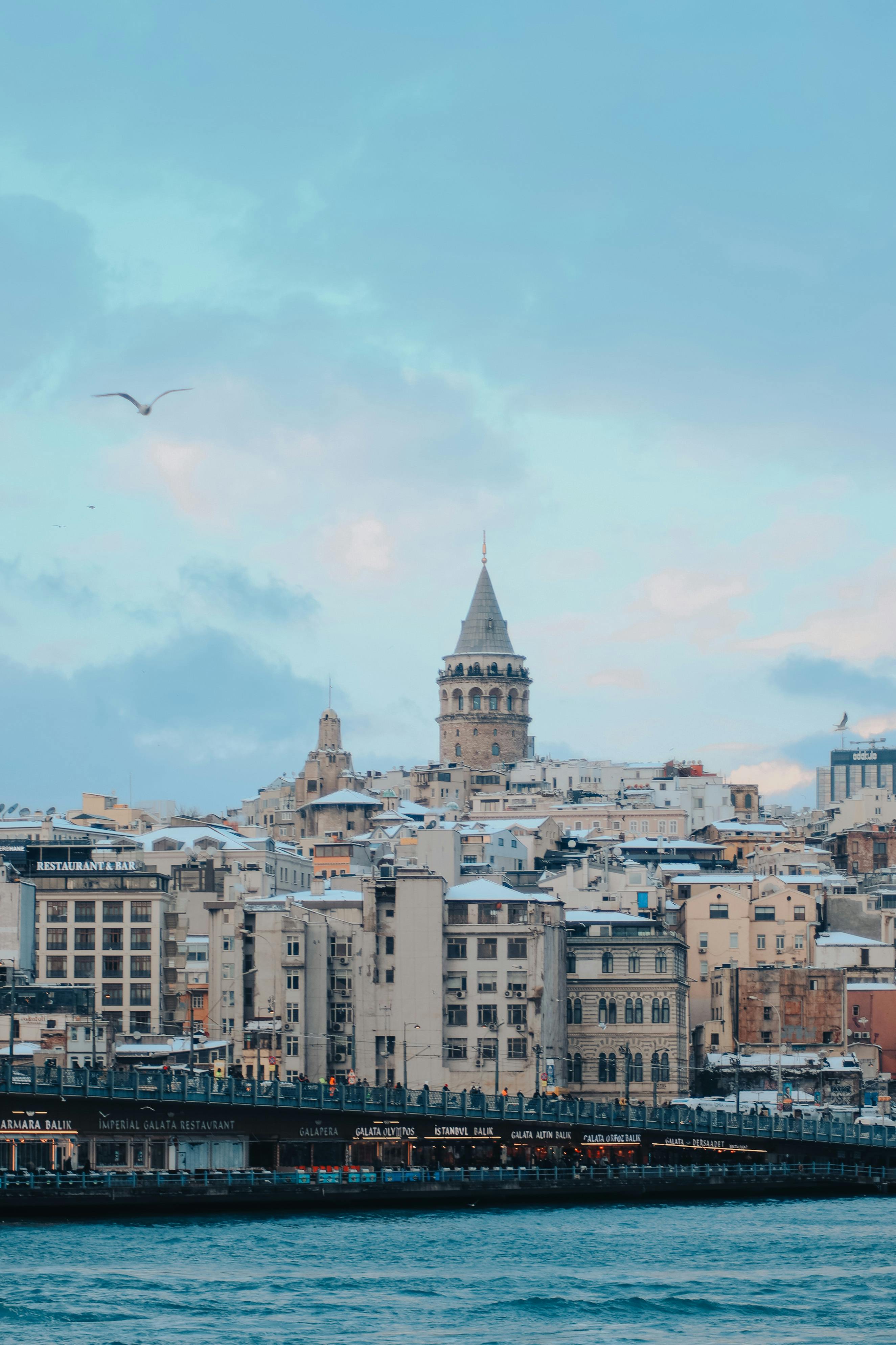 Cityscape View over Sea With Lights Turned on during Night · Free Stock ...