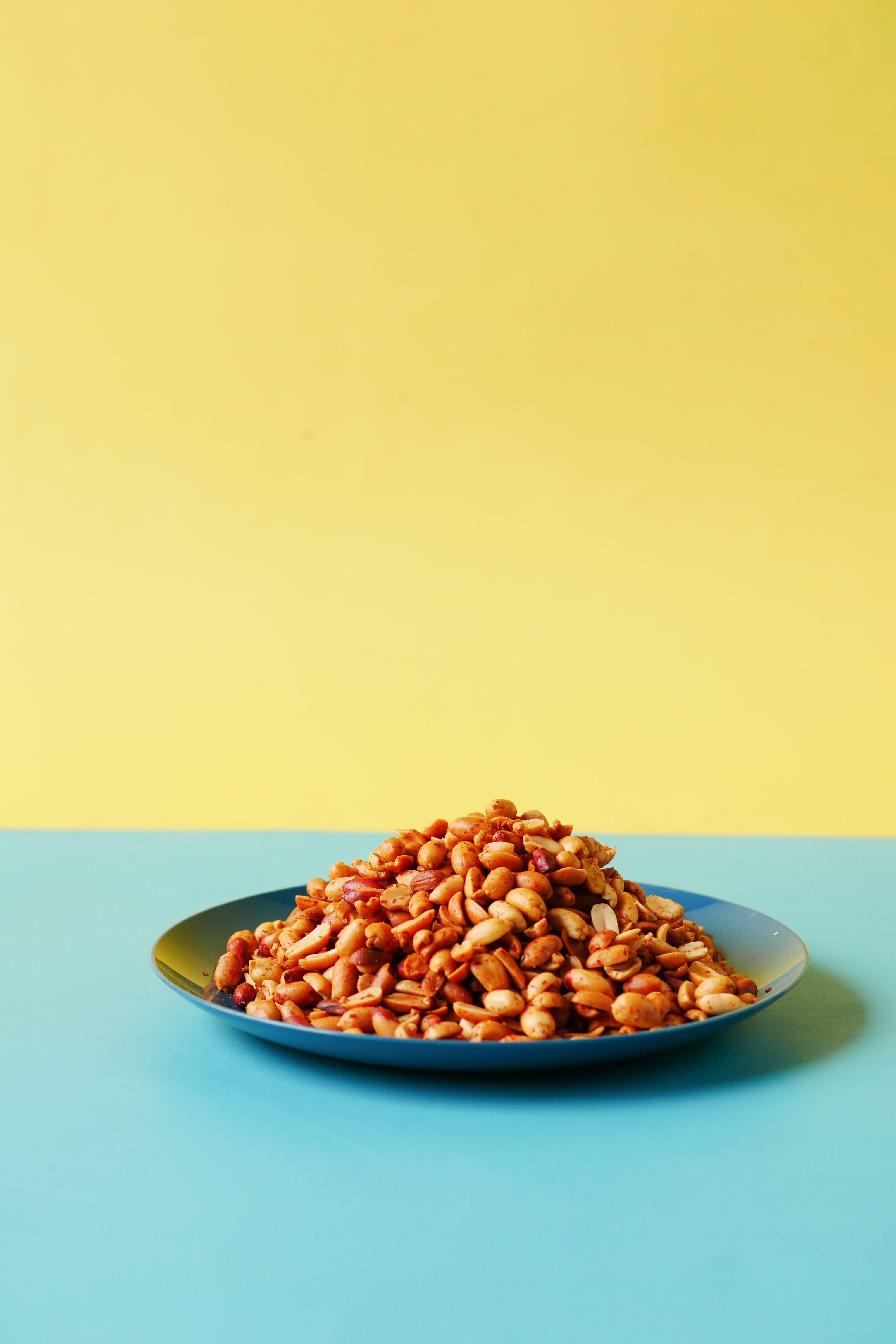 Brown Nuts on Ceramic Plate · Free Stock Photo