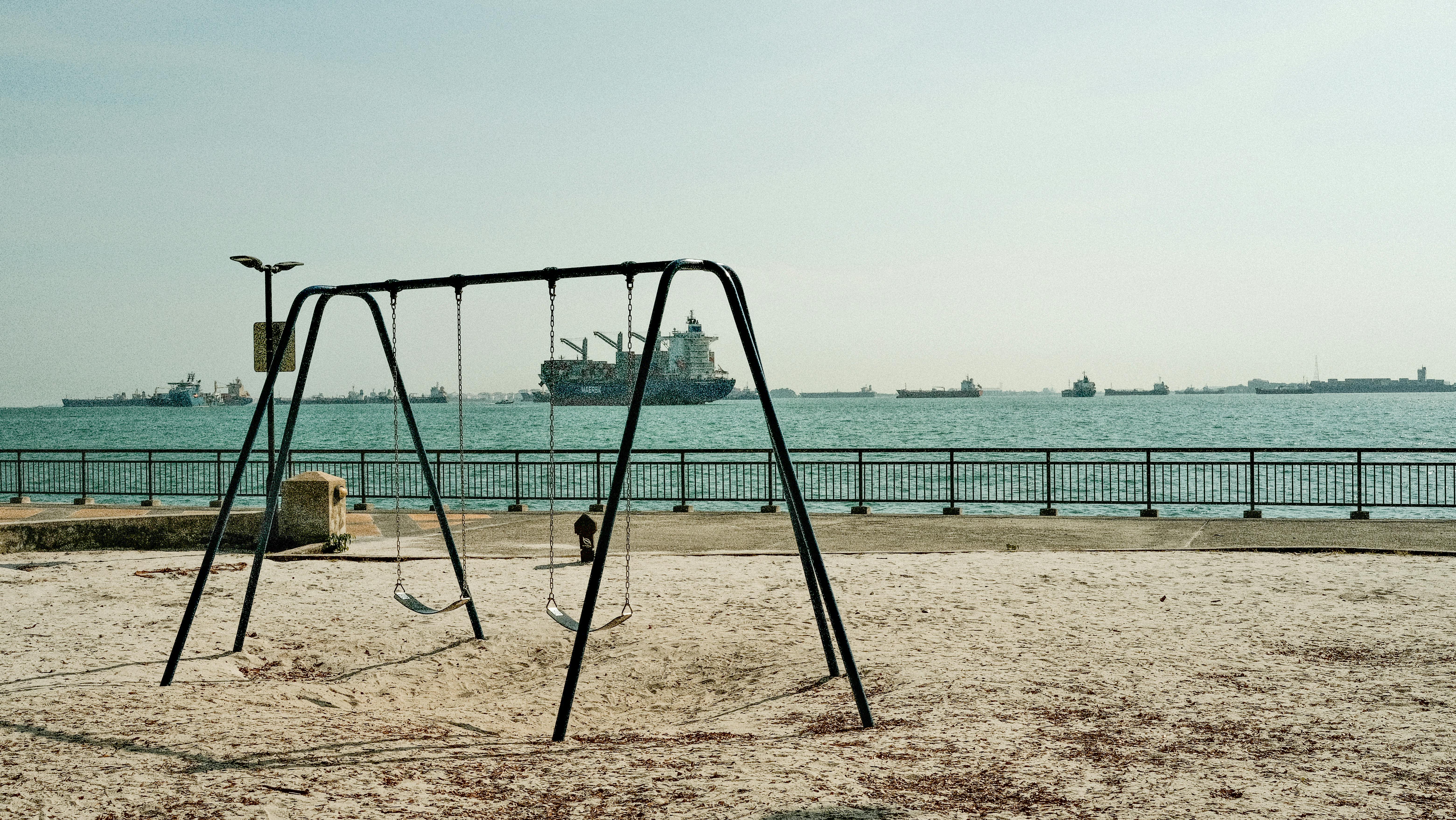 Swings by a Sea · Free Stock Photo