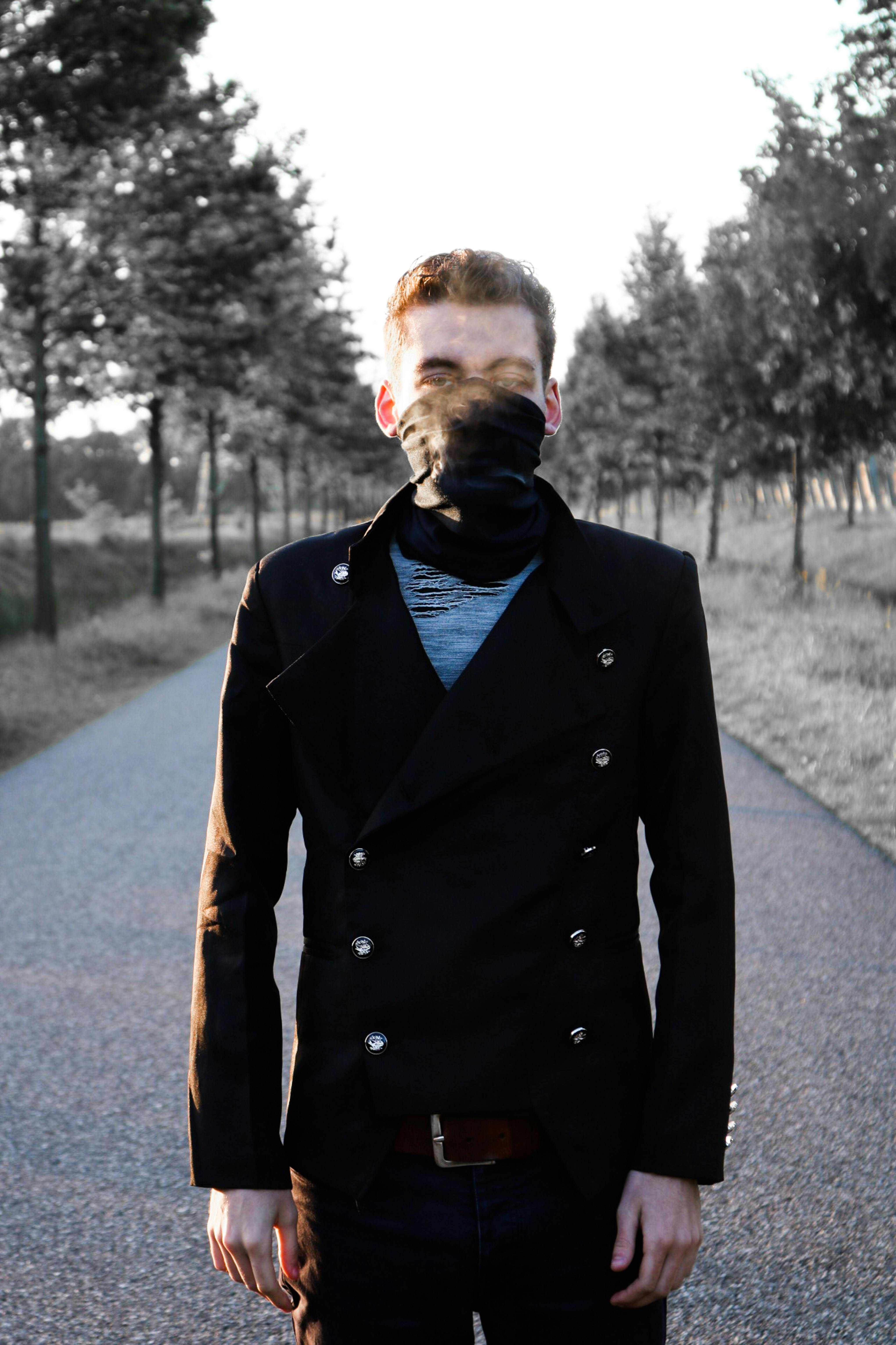 Young man in mask standing in park · Free Stock Photo