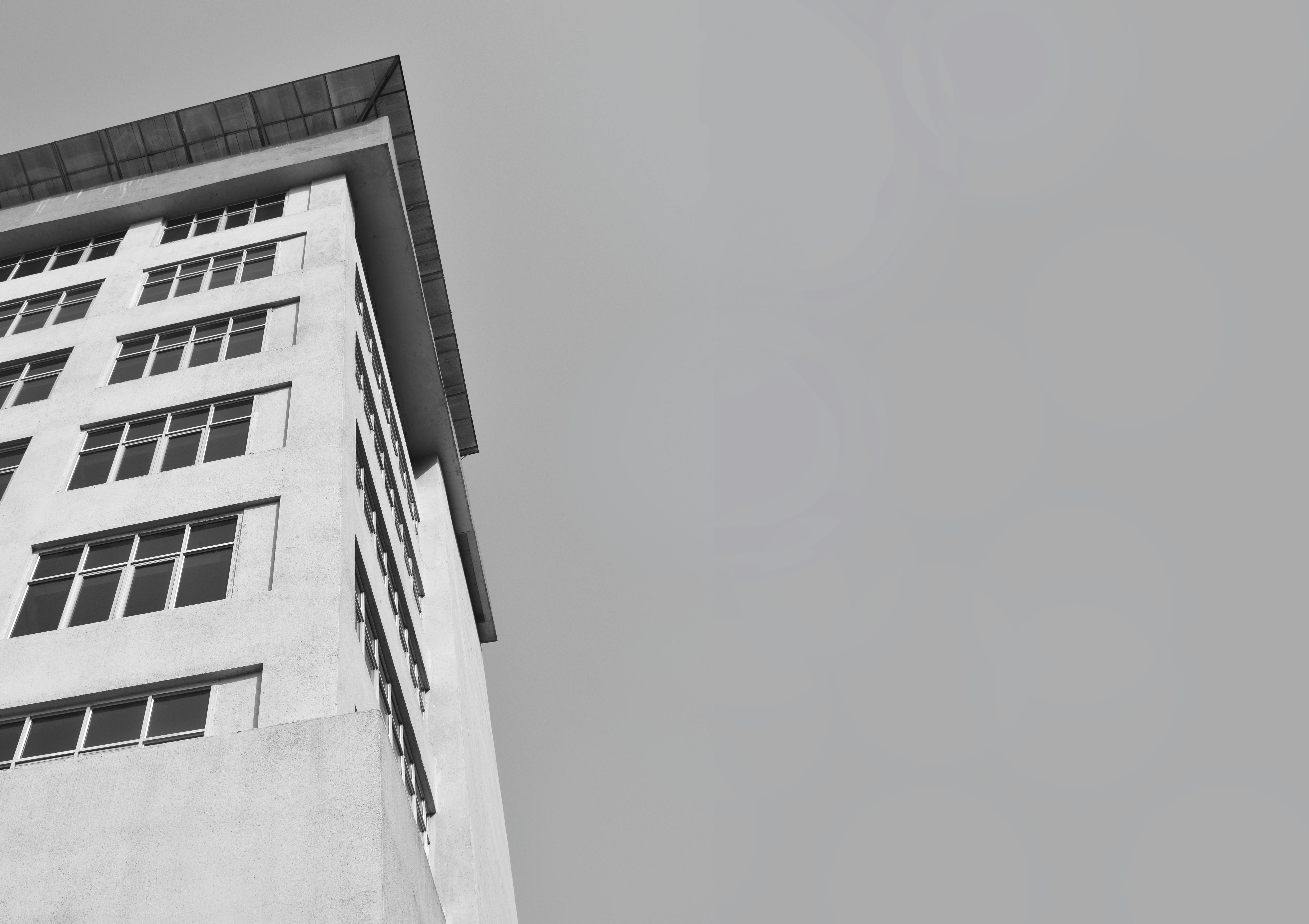 Grayscale Photo of Brick Building · Free Stock Photo