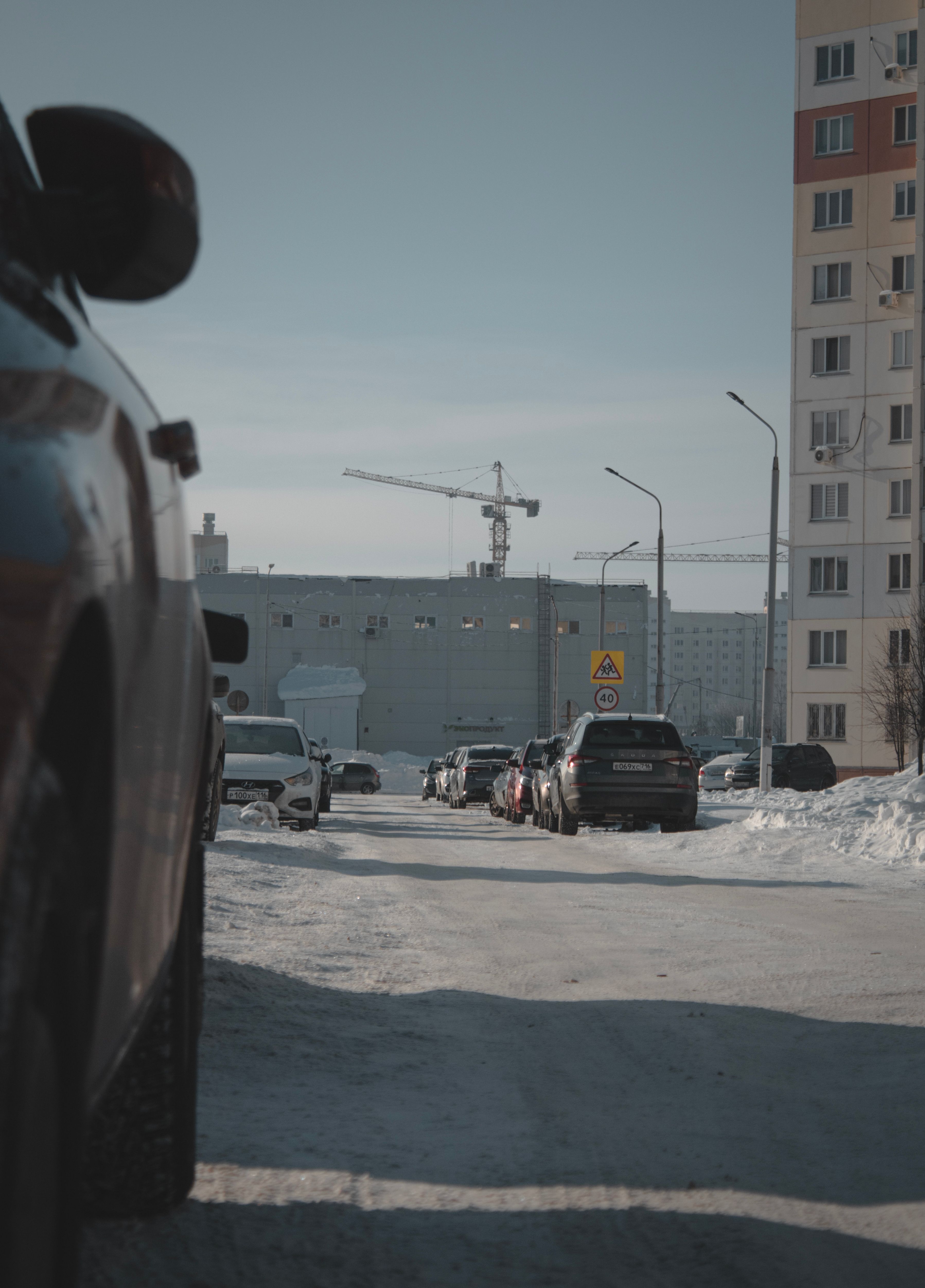Black Car on Concrete Pavement Near Under Construction Building · Free ...