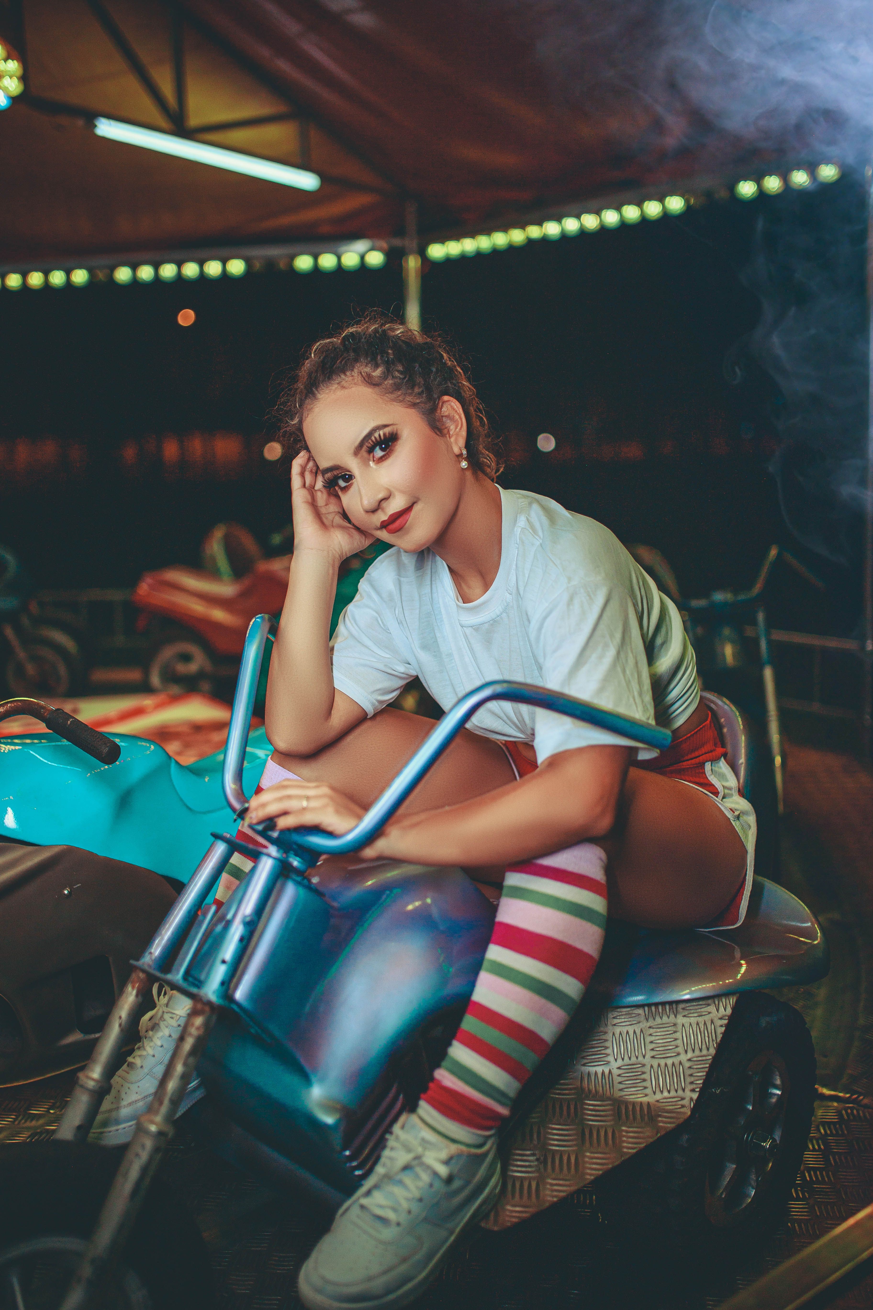 Woman in White Button Up Shirt Sitting · Free Stock Photo