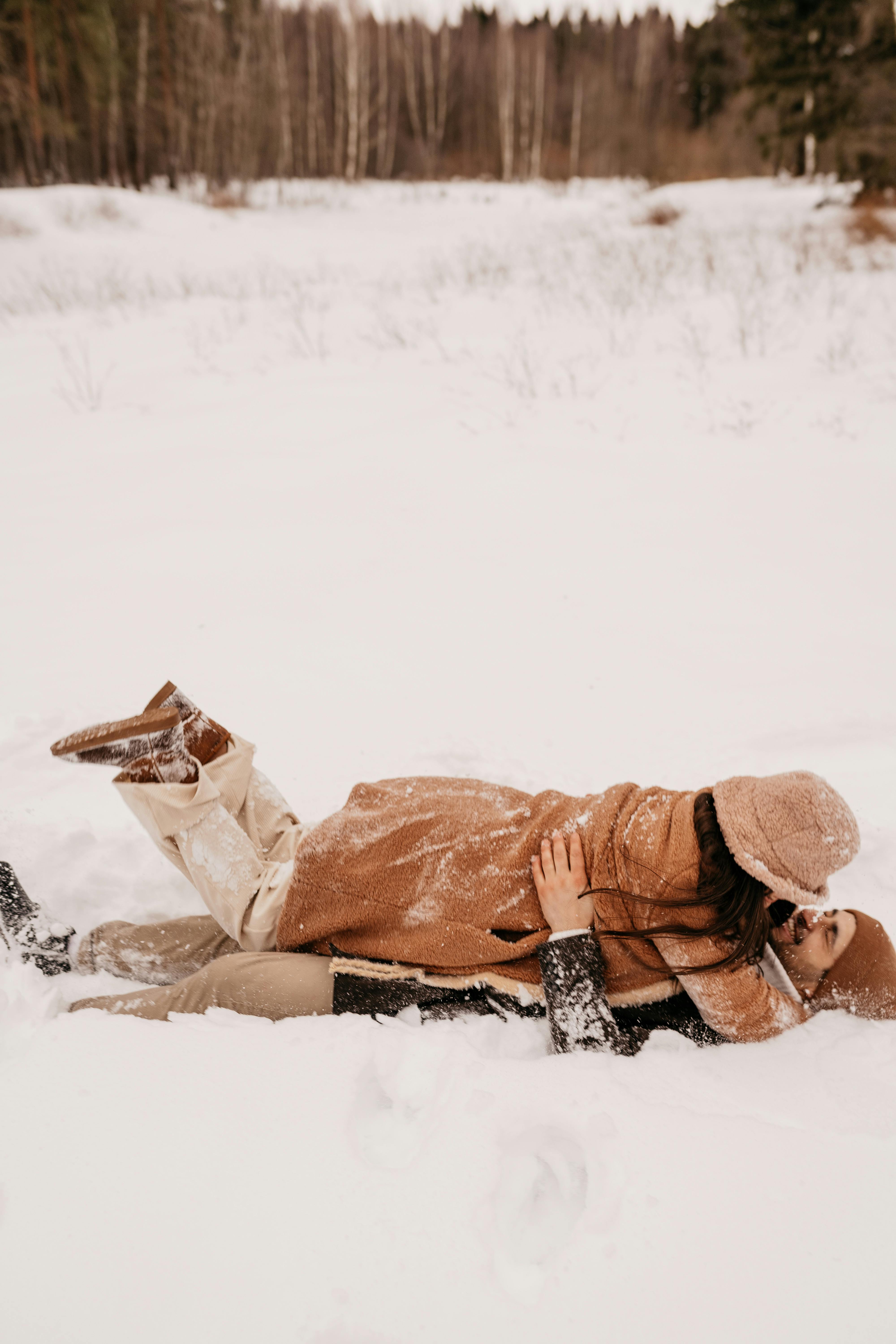 A Couple Having Fun in the Snow · Free Stock Photo