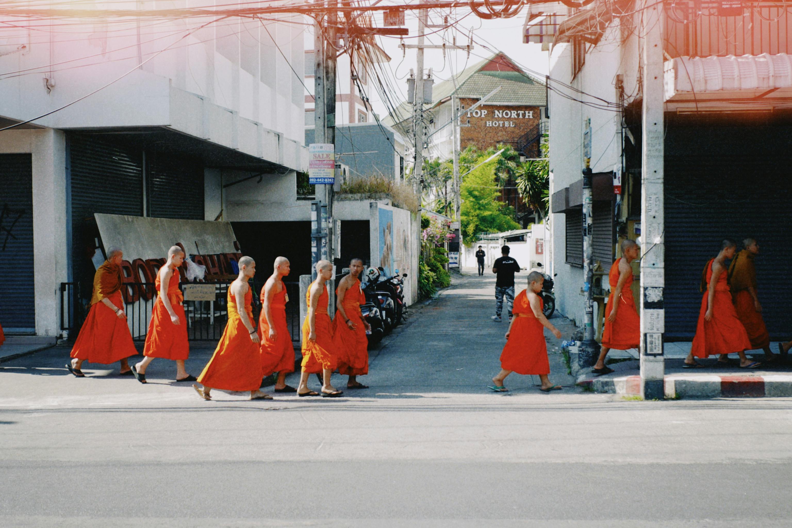 Side View of Monks Walking in the Street · Free Stock Photo