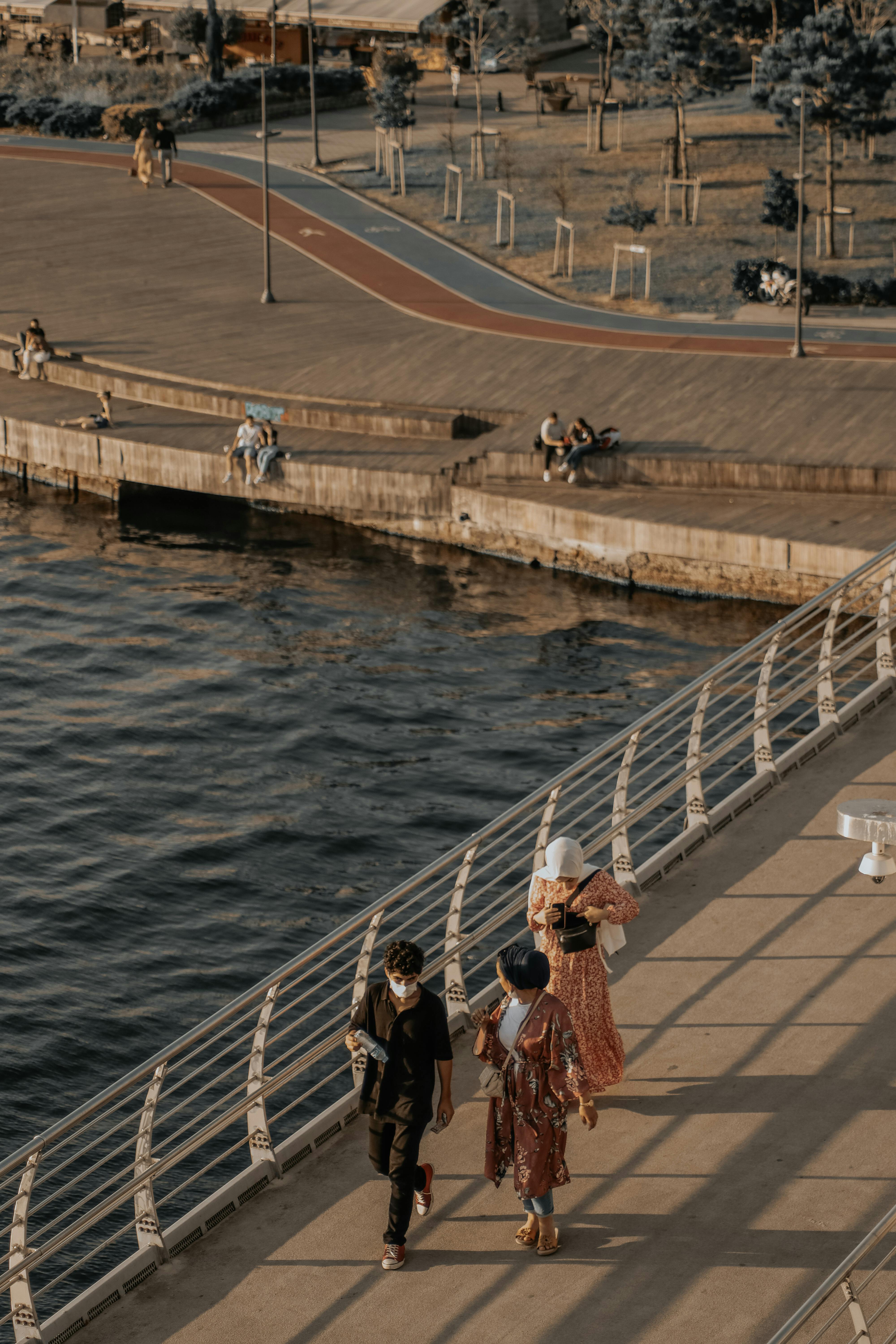 People Walking on Promenade on Shore · Free Stock Photo