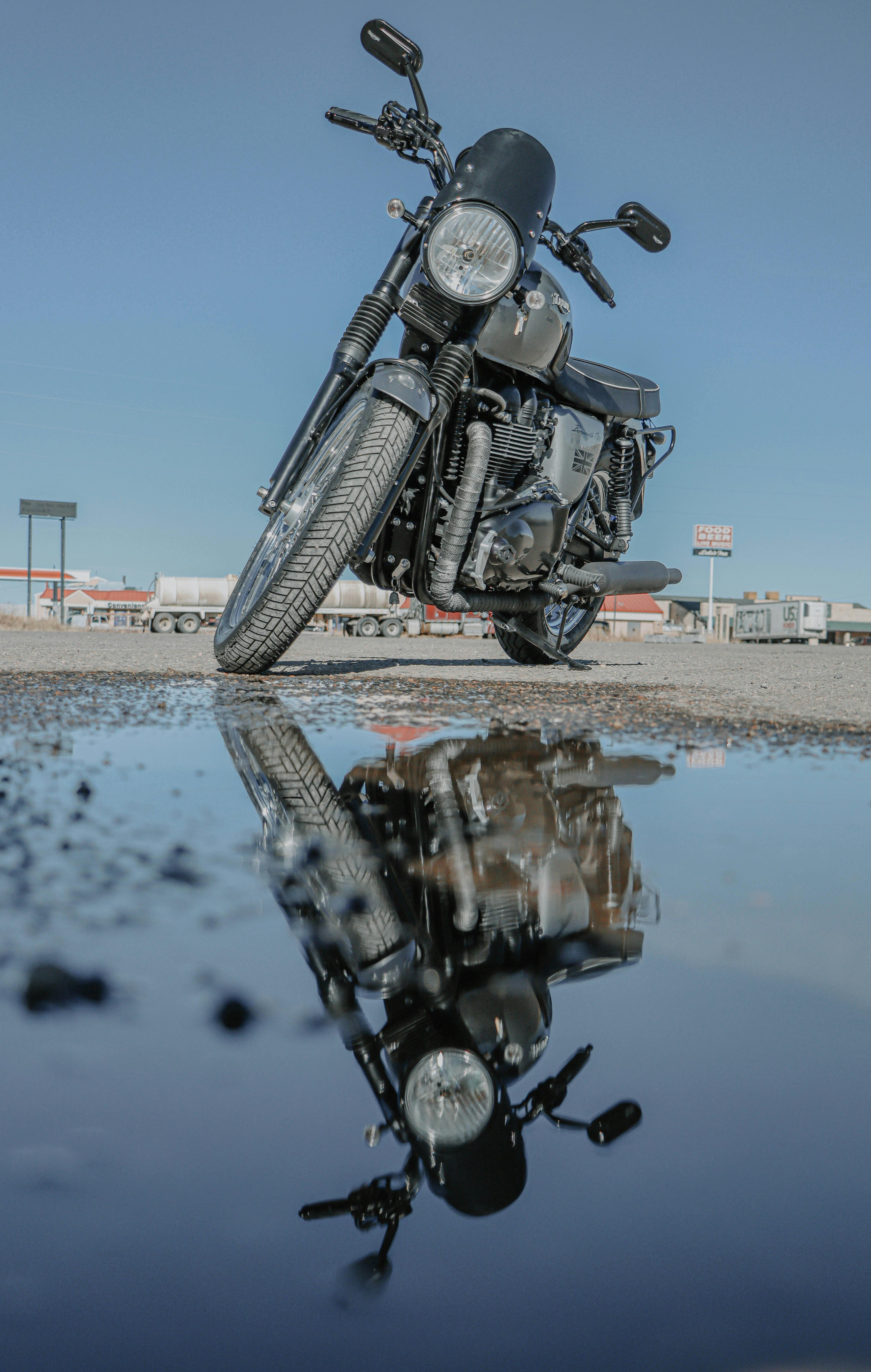 Reflection of a Motorcycle on Water · Free Stock Photo