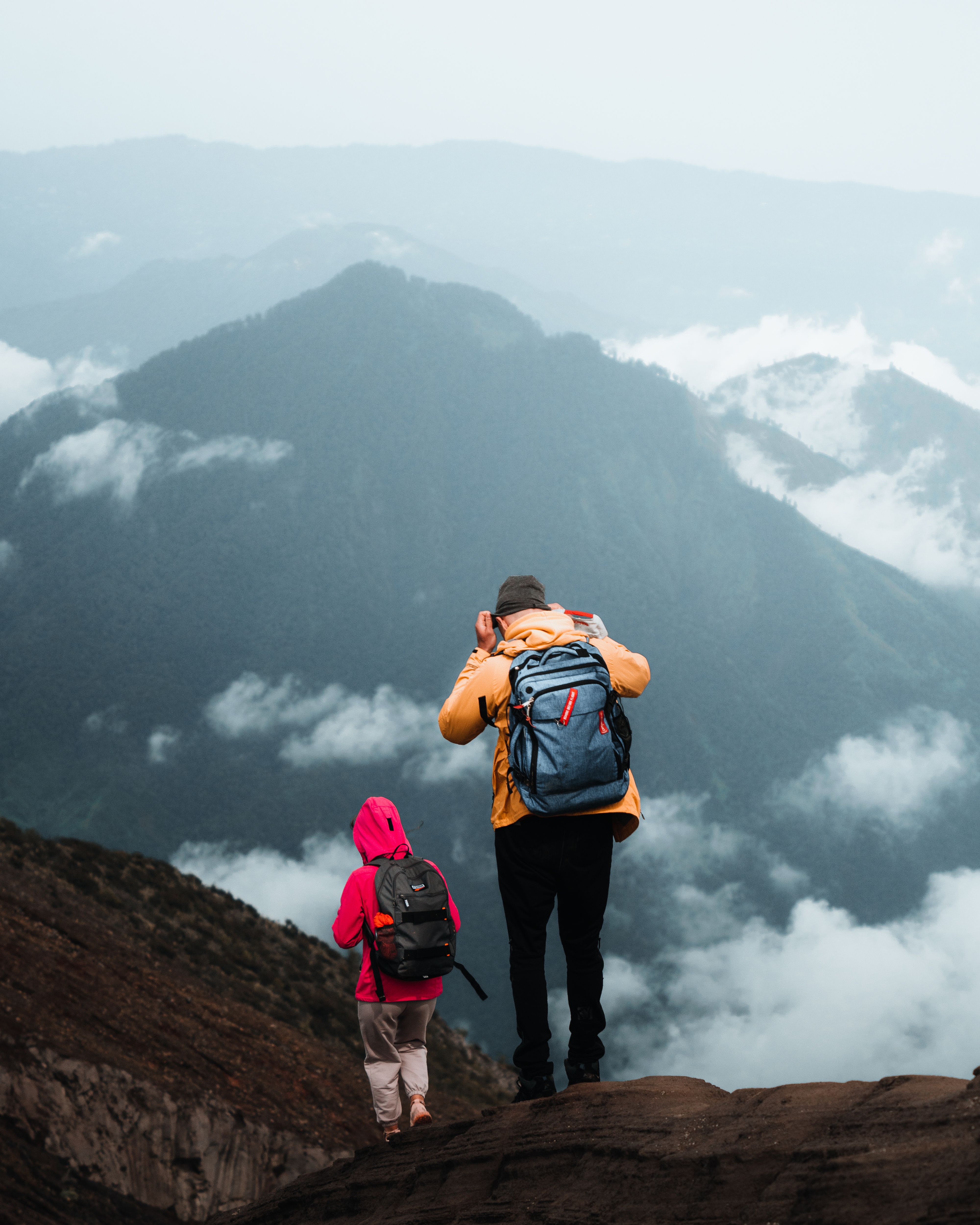 Back View of People Hiking on Mountain · Free Stock Photo