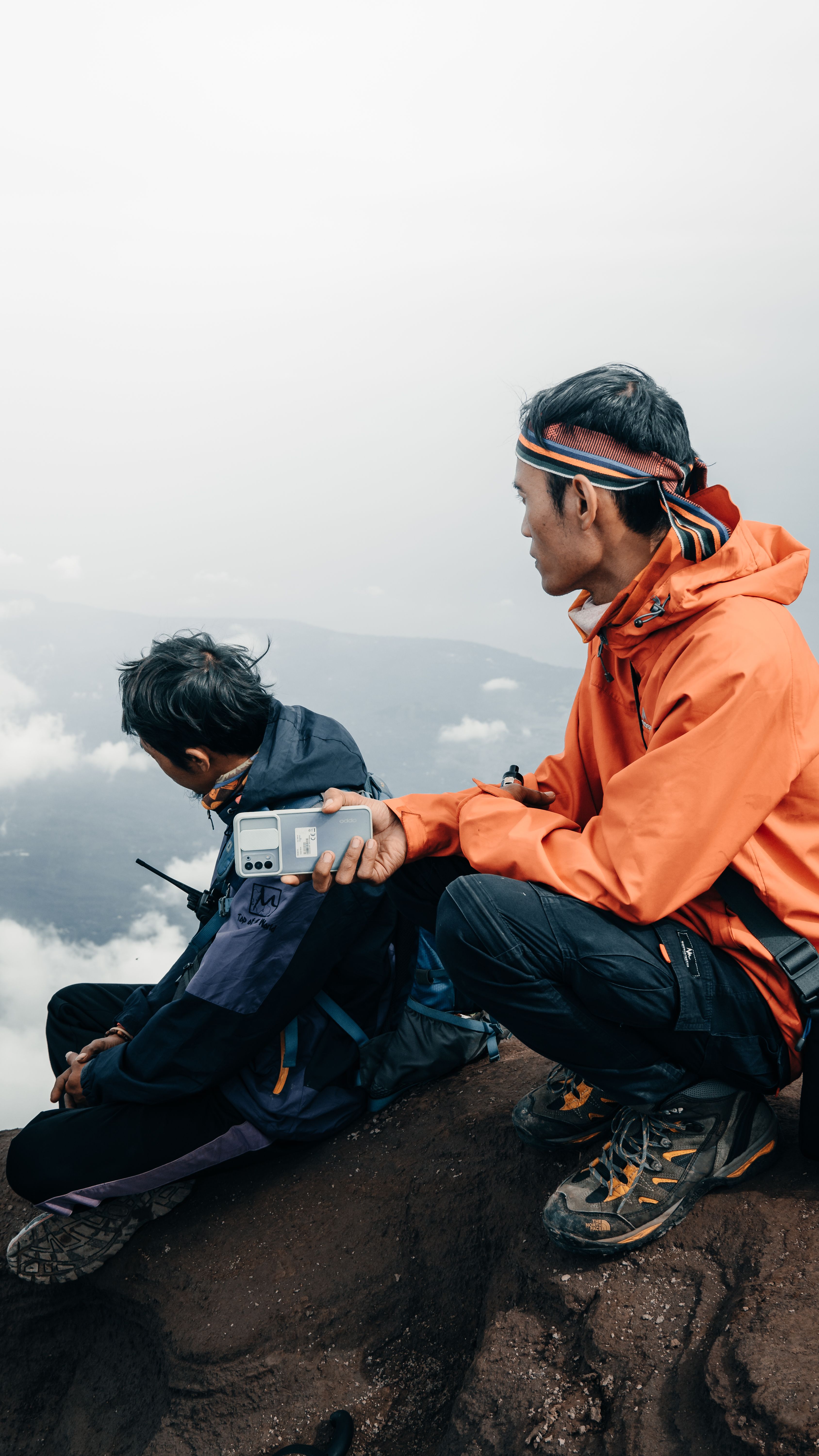 Men Sitting on Rocks · Free Stock Photo