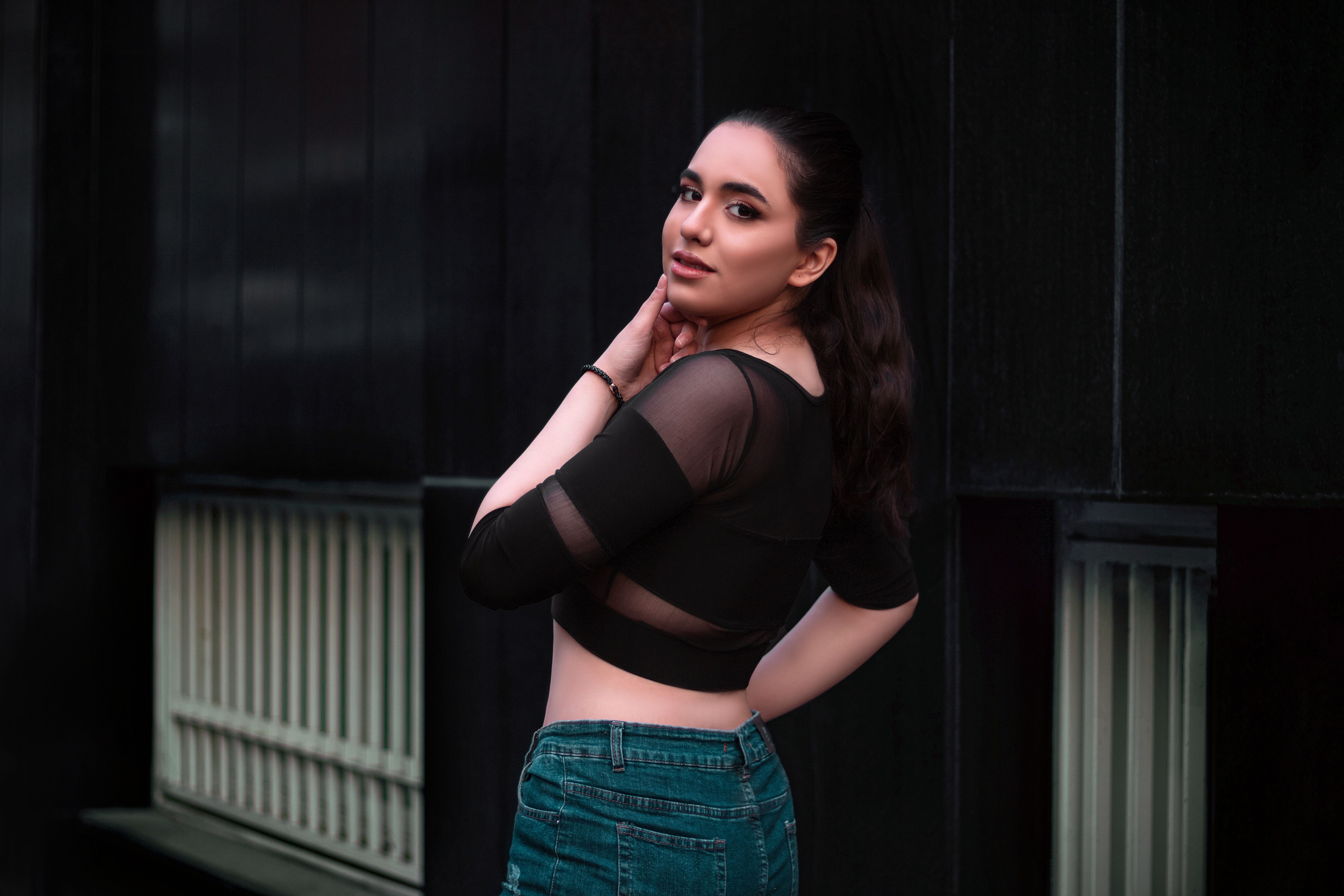 Beautiful Woman Looking over Shoulder · Free Stock Photo