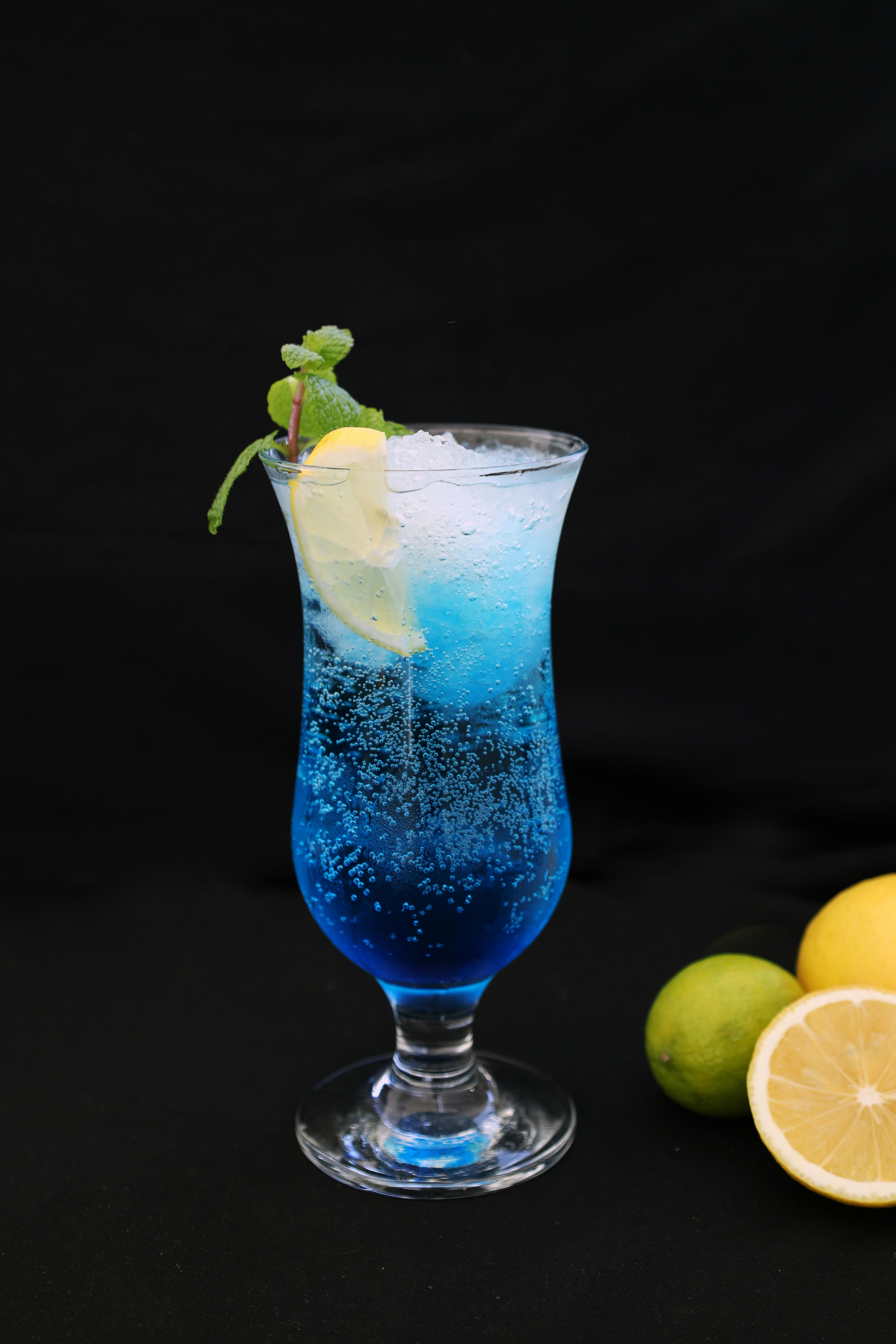 Blue Sparkling Drink on a Glass · Free Stock Photo