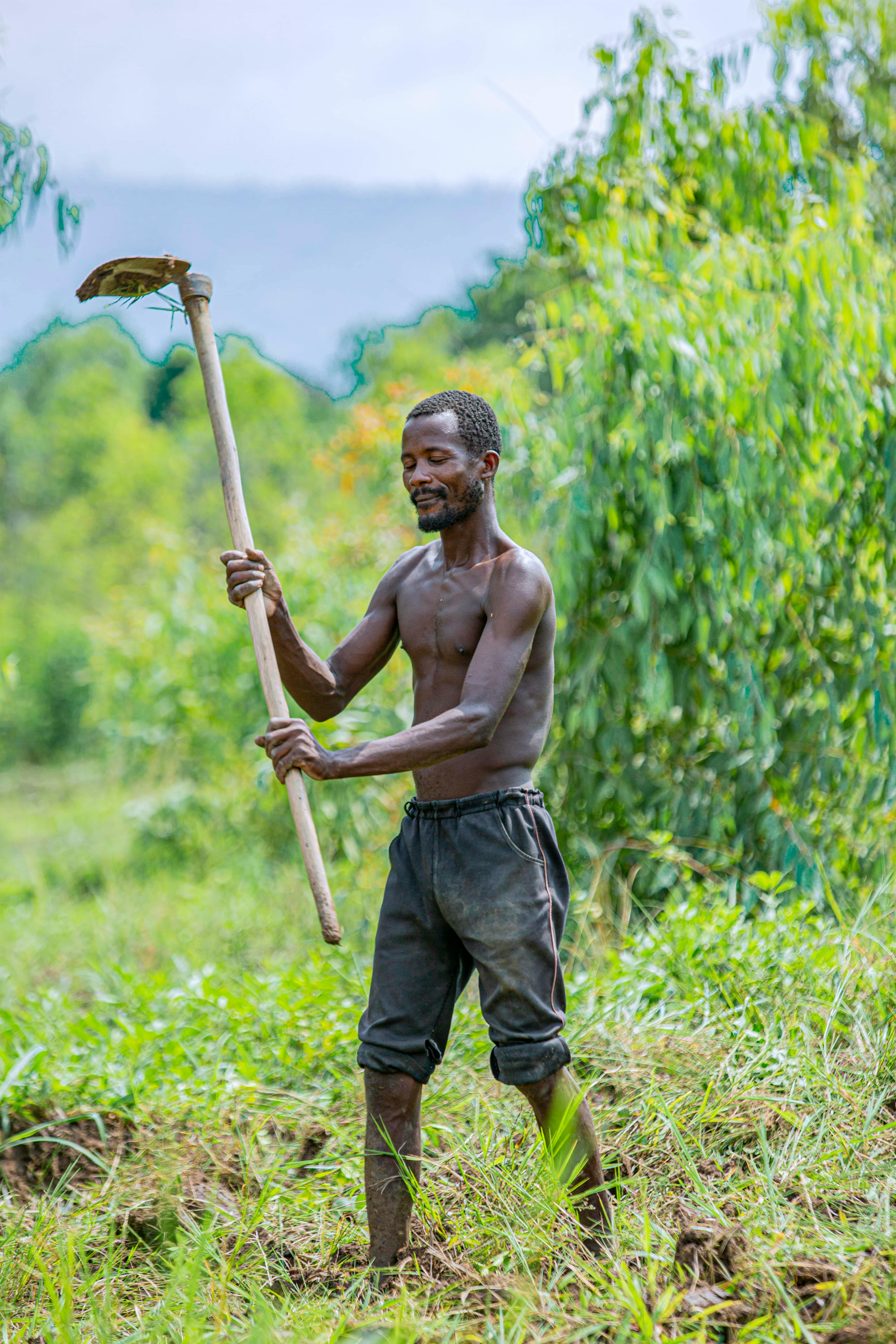 Topless Man holding a Hoe · Free Stock Photo