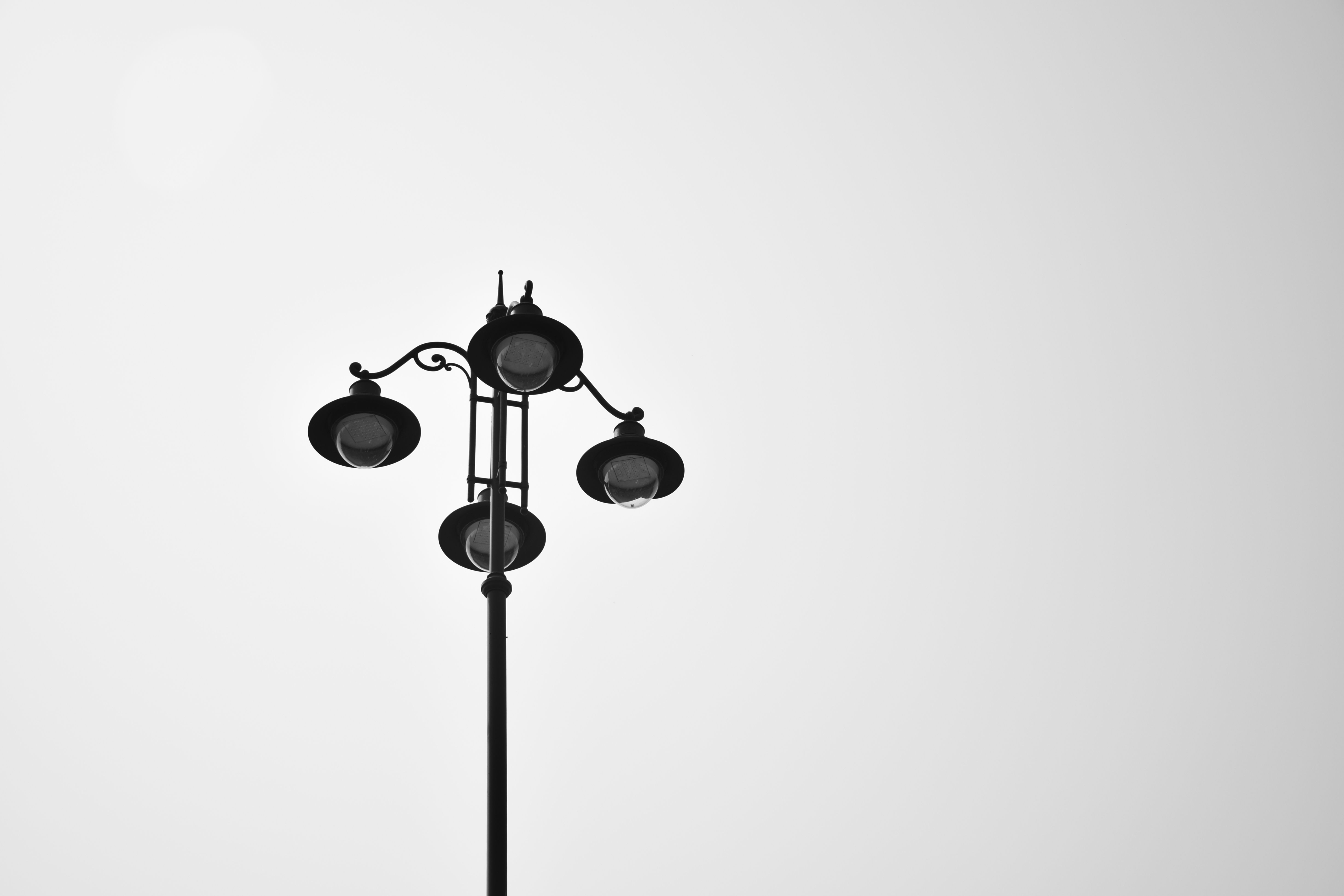 Concrete Bench Lamp Post Grayscale Photo · Free Stock Photo