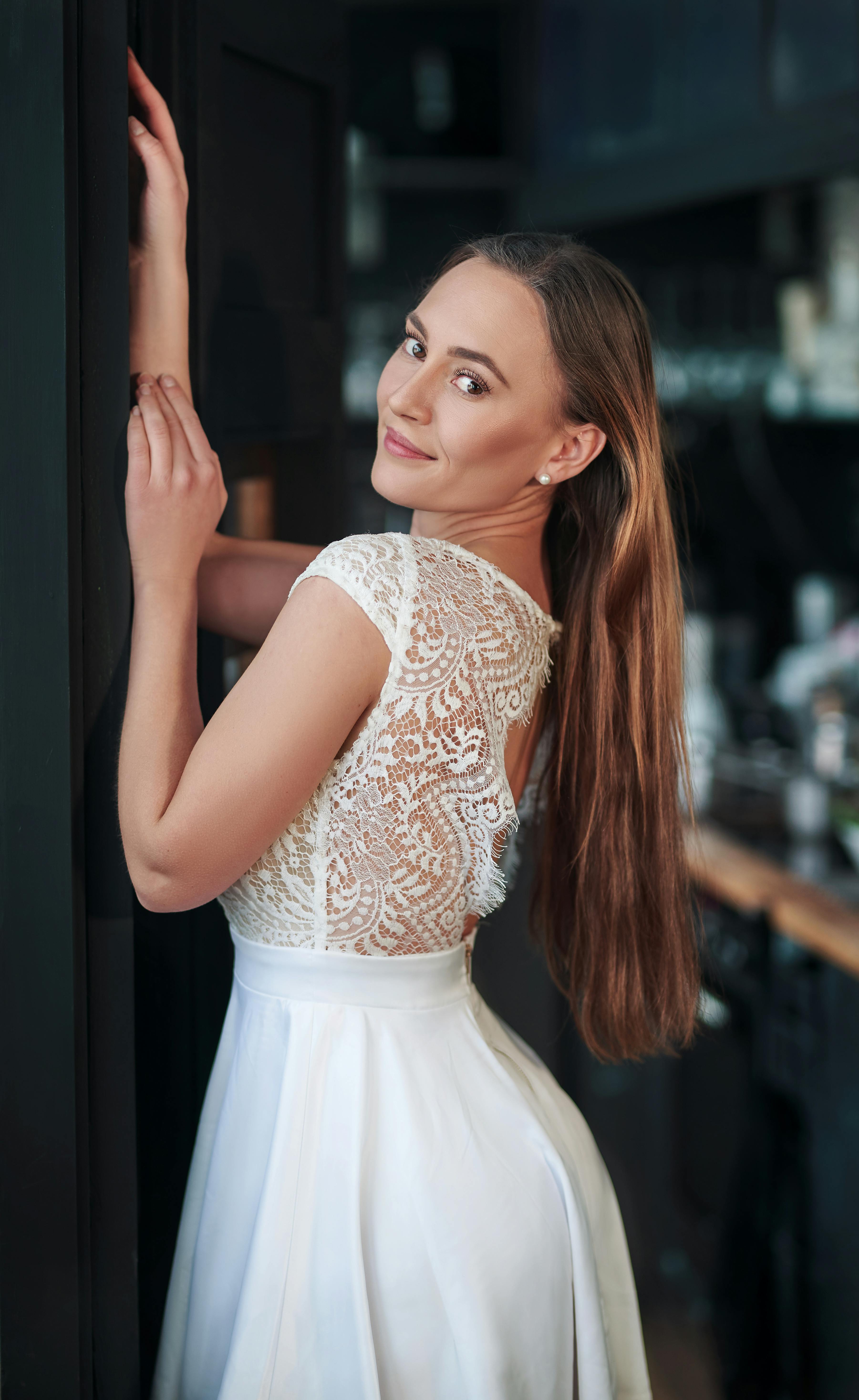 Photo of a Standing Bride Wearing Wedding Dress · Free Stock Photo