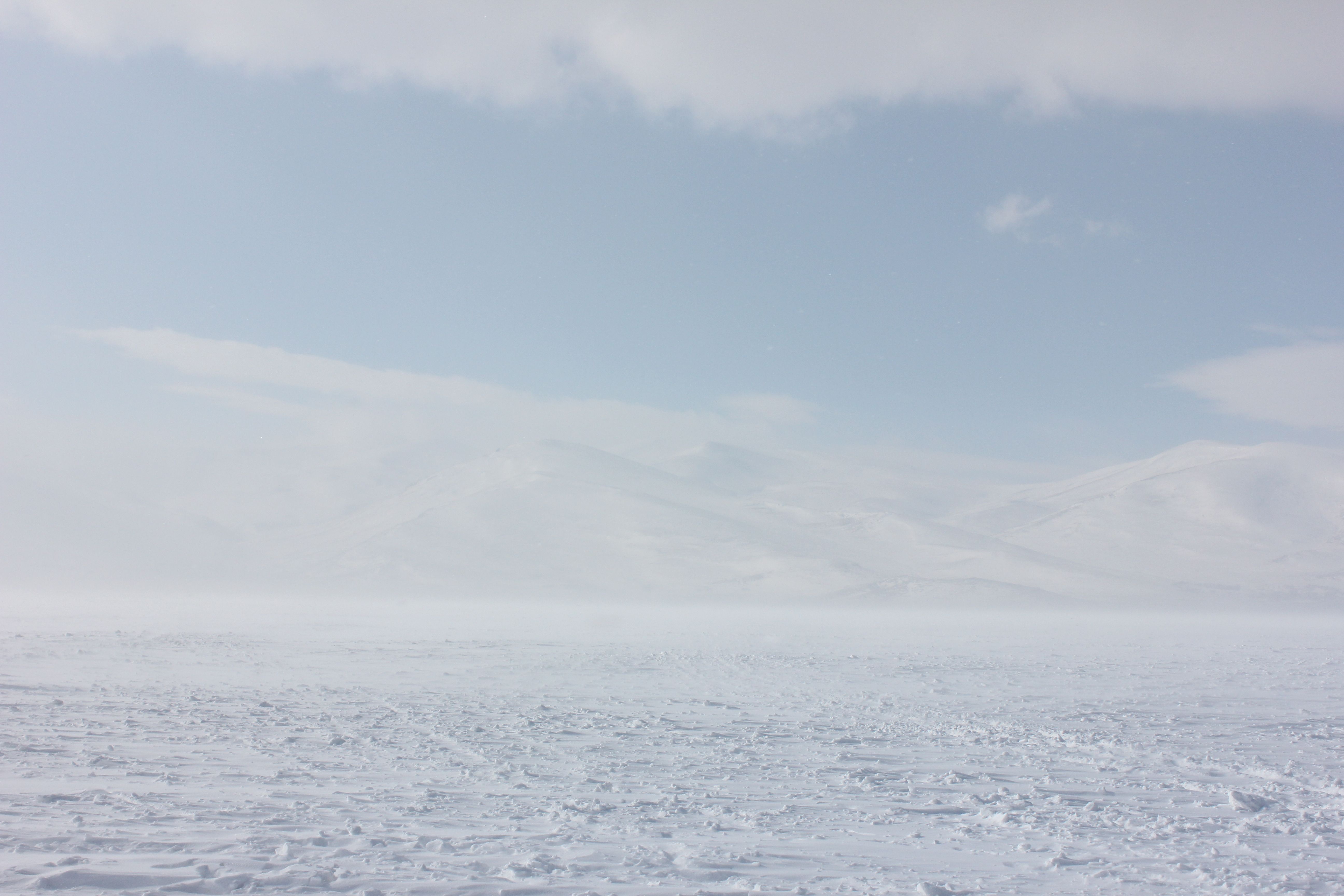Snow Covered Field and Mountains Under the Sky · Free Stock Photo