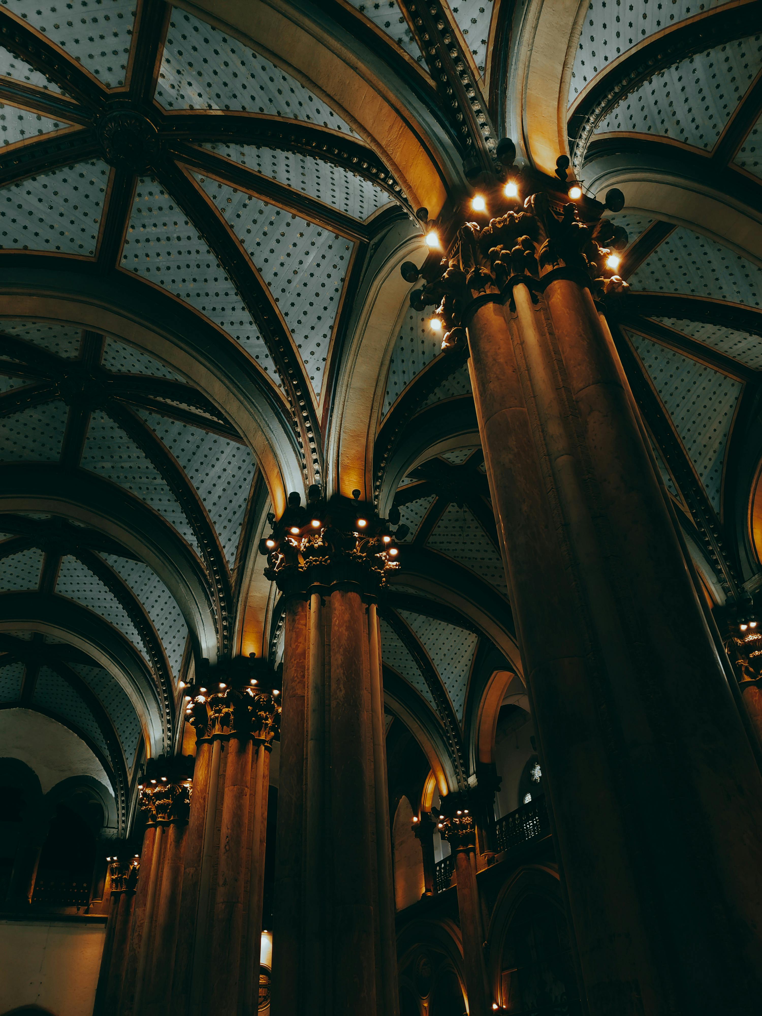 Illuminated Columns Inside Old Building · Free Stock Photo