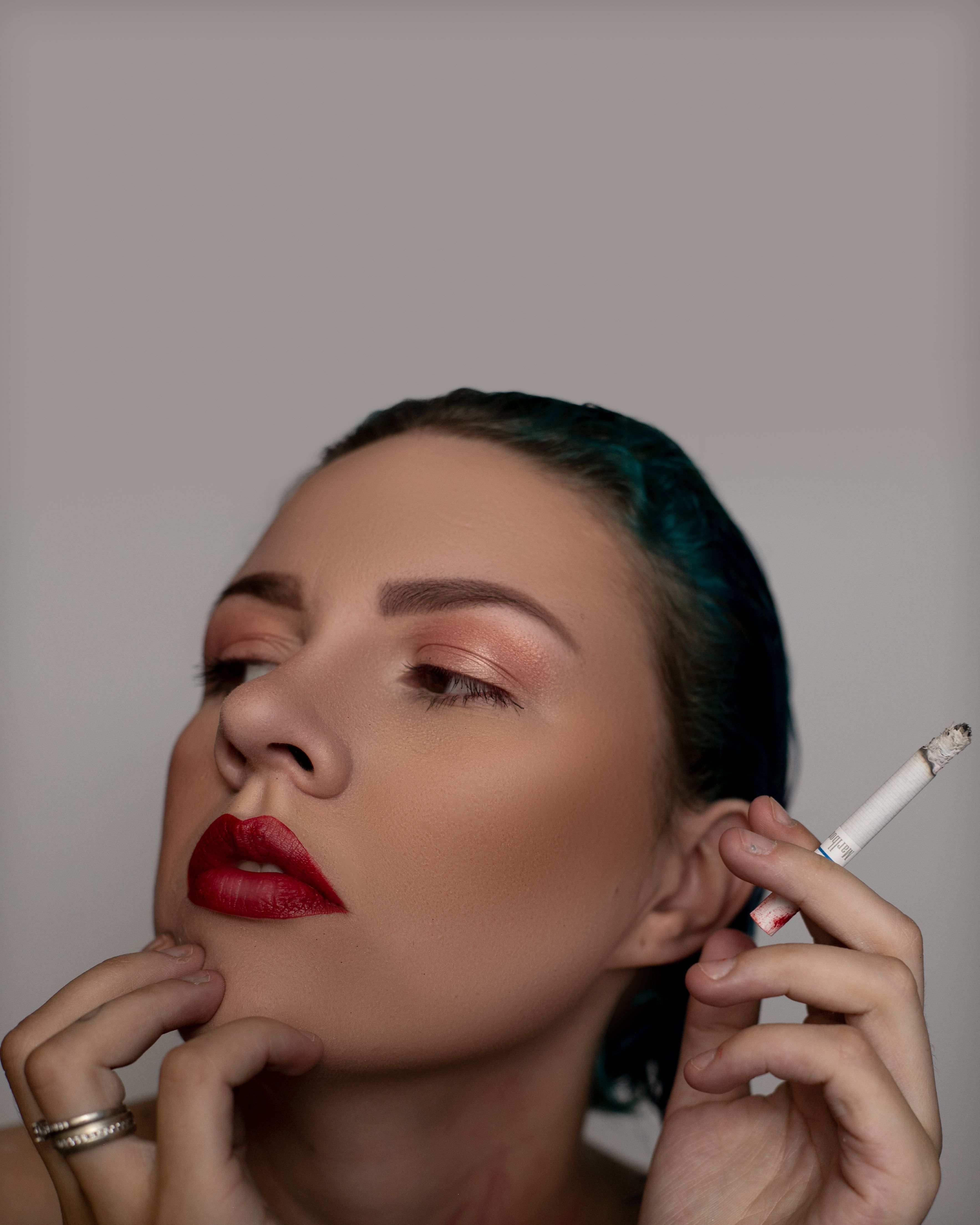 A Woman Smoking a Cigarette · Free Stock Photo