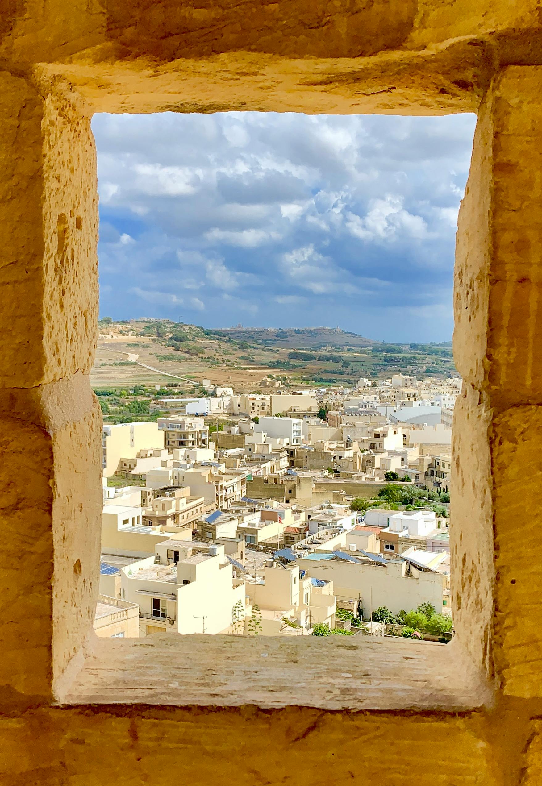 City in Desert Seen Through Window · Free Stock Photo