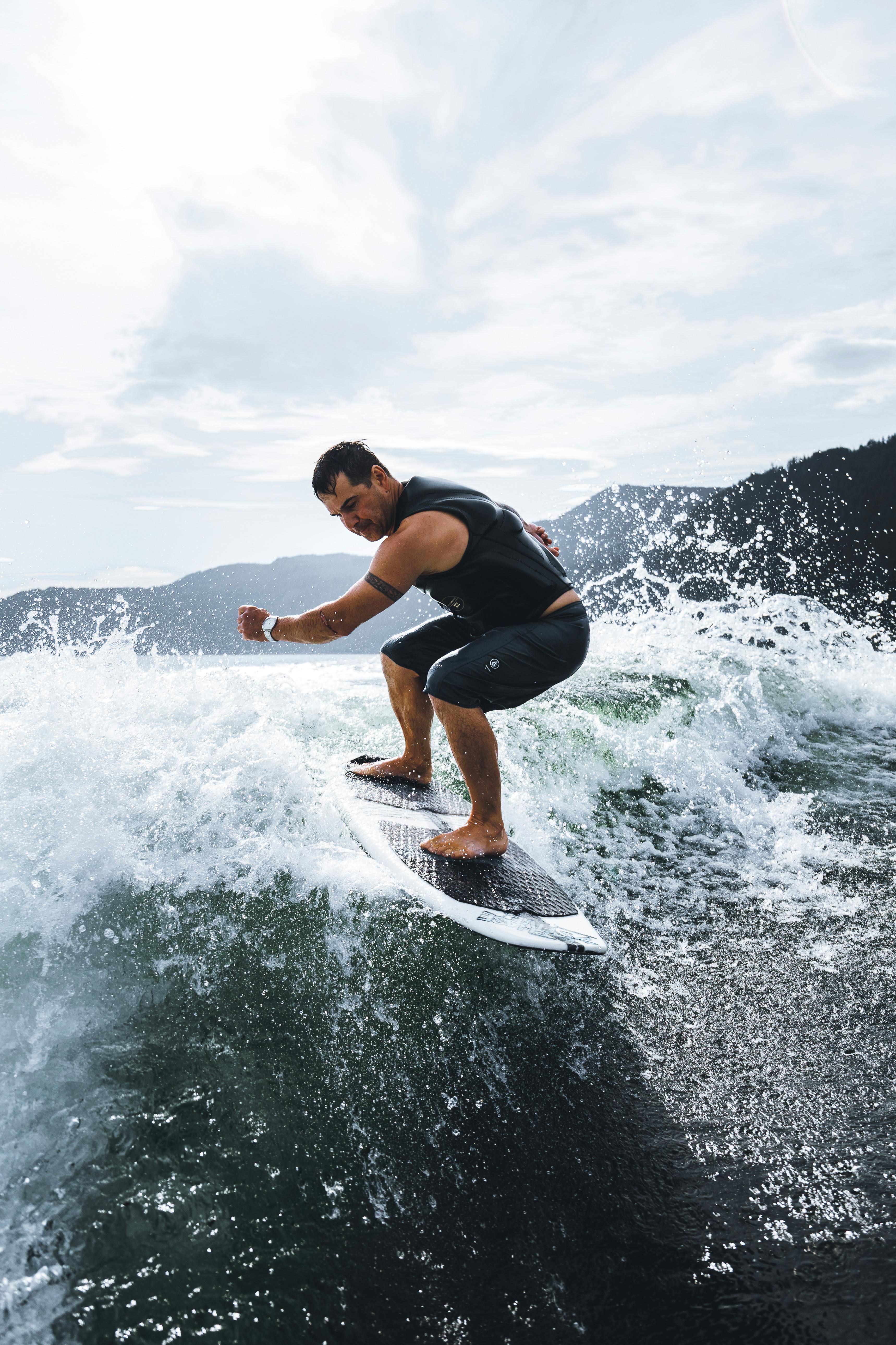 Man Doing Surfing at Golden Hour · Free Stock Photo