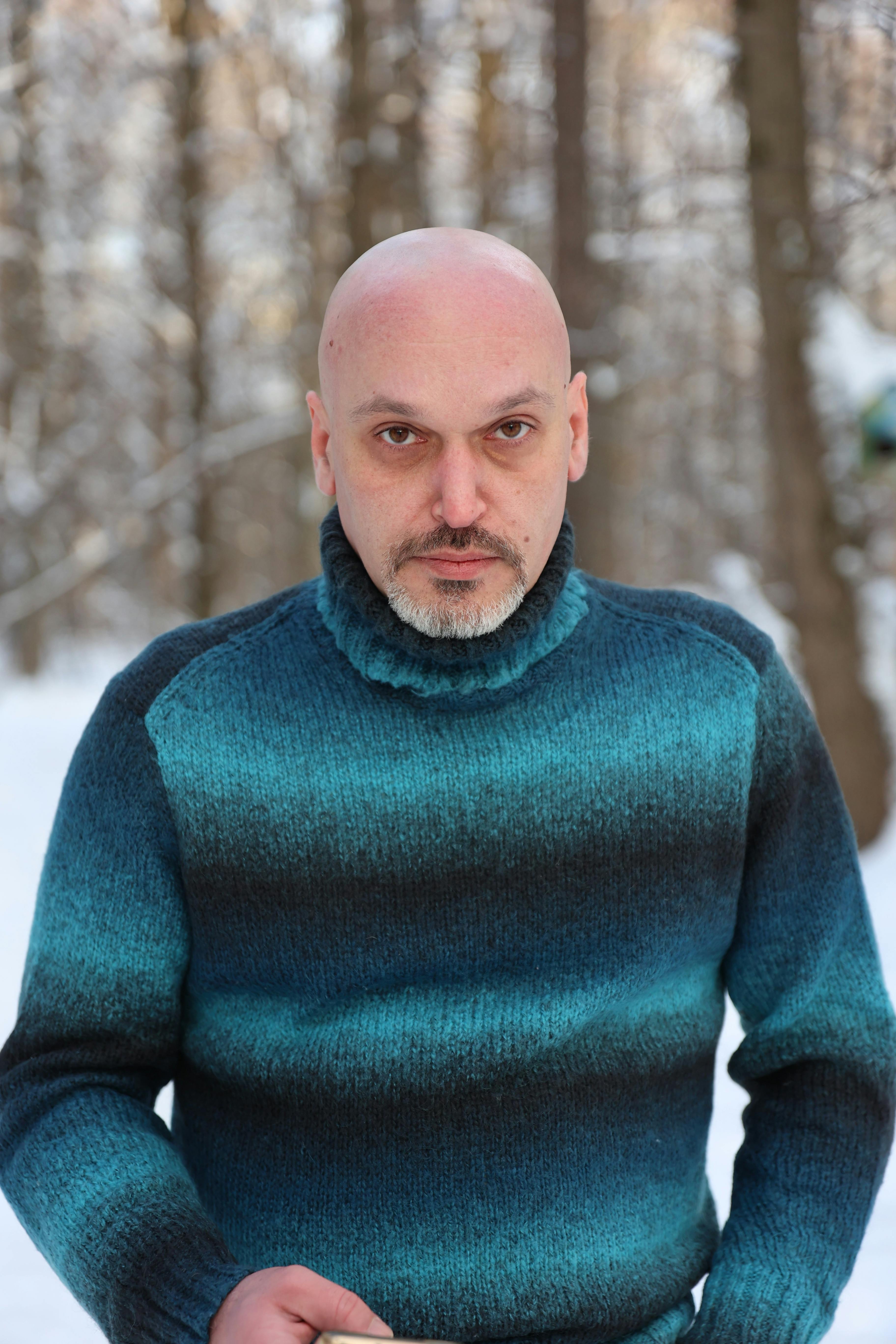 Bald Man in Turtleneck Sweater Standing Near Trees · Free Stock Photo