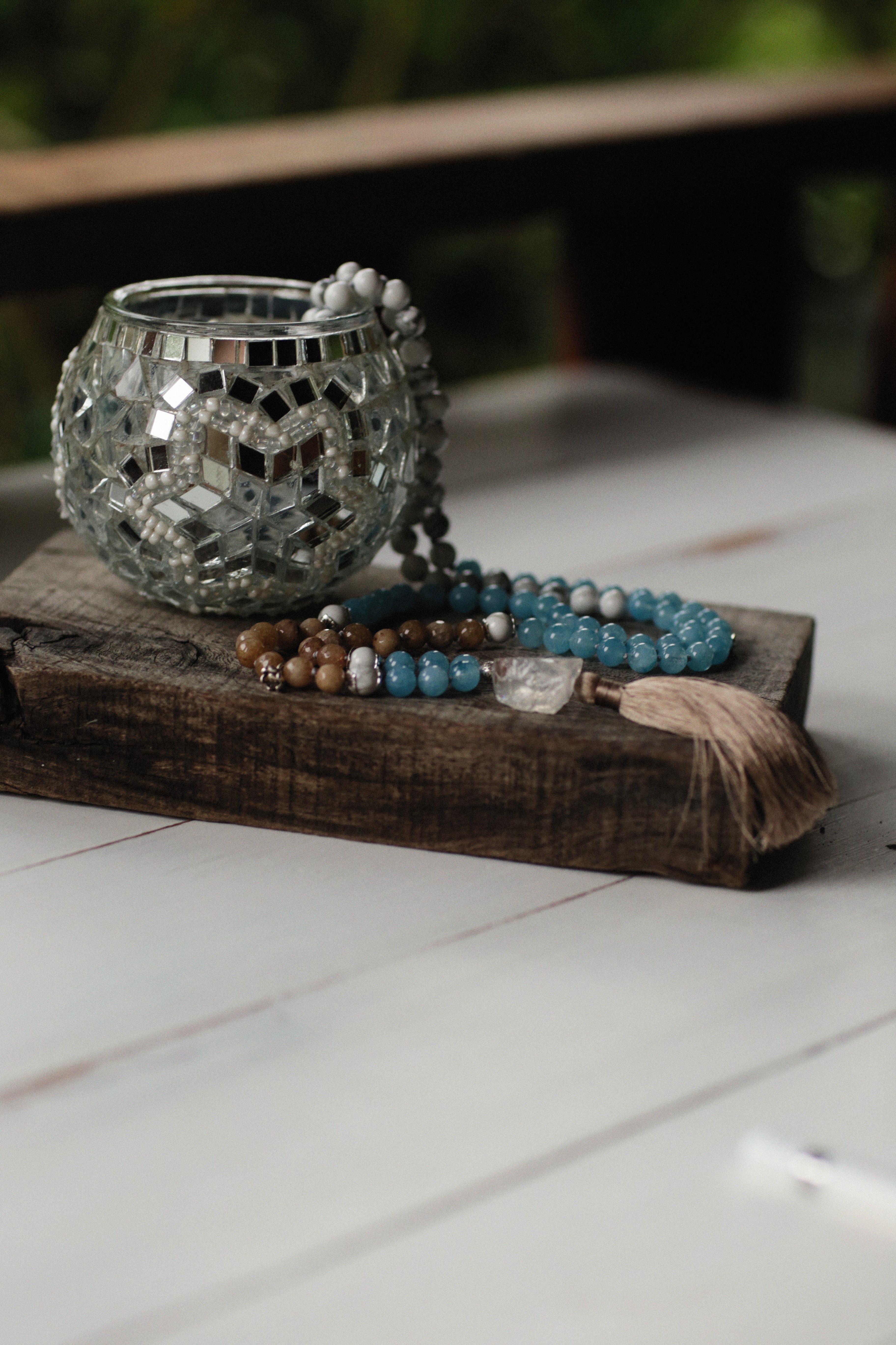 Prayer Beads and a Silver Container · Free Stock Photo