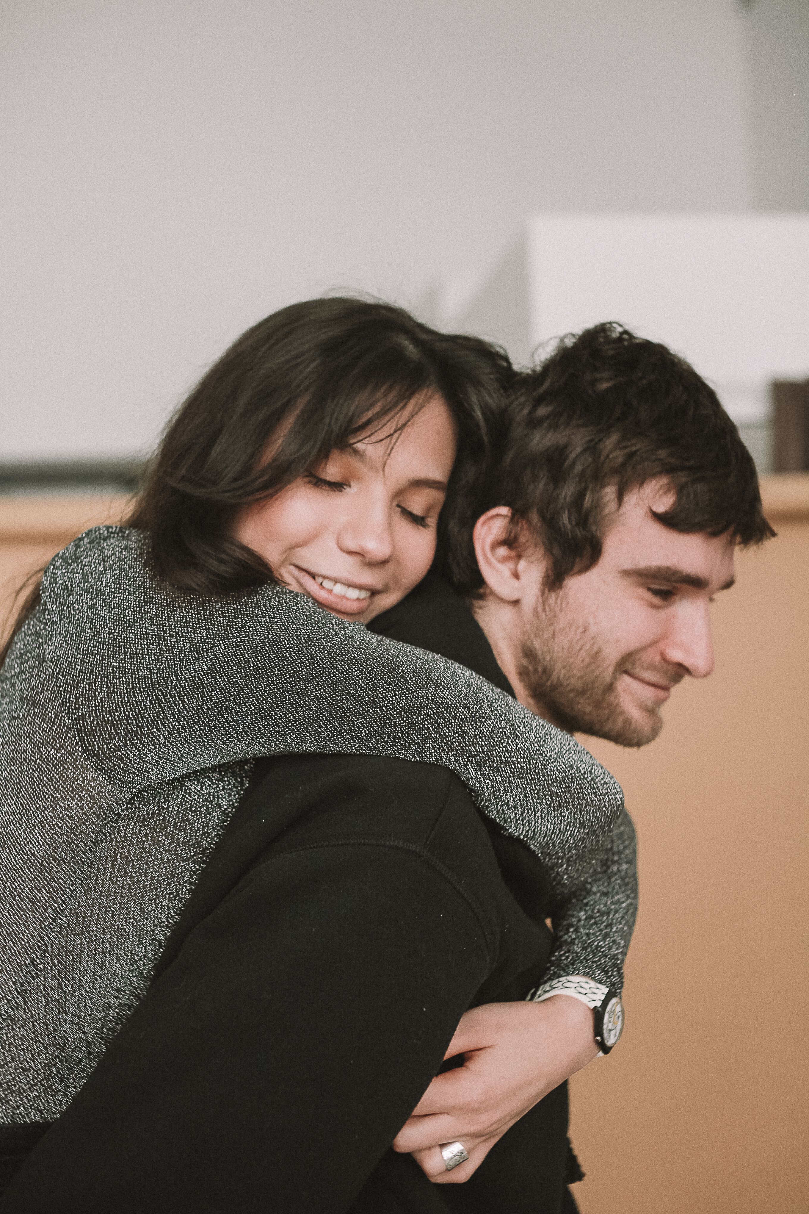 Man Sitting on Beach and Hugging Woman in His Arms · Free Stock Photo