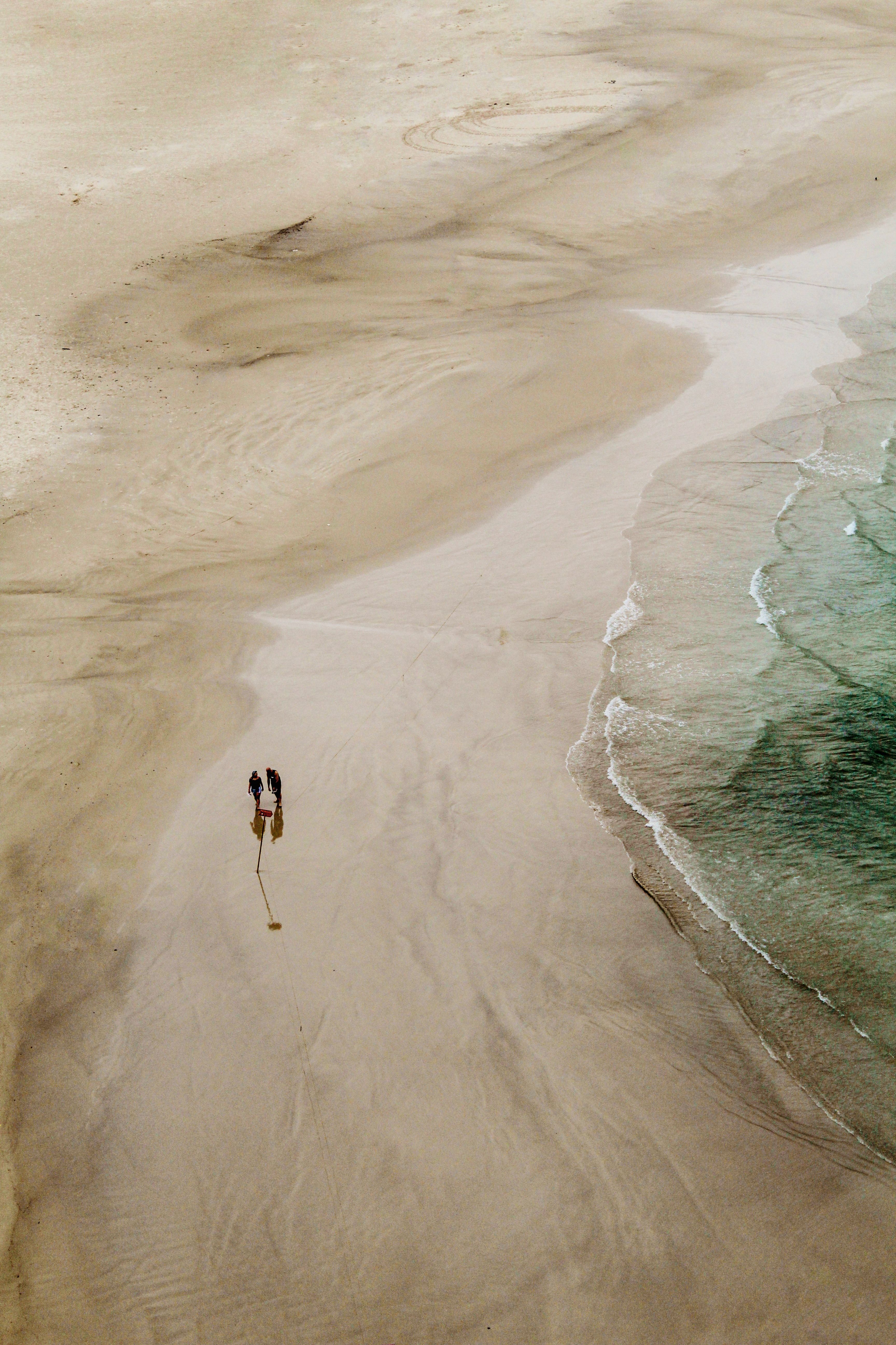 Two People on Sand · Free Stock Photo