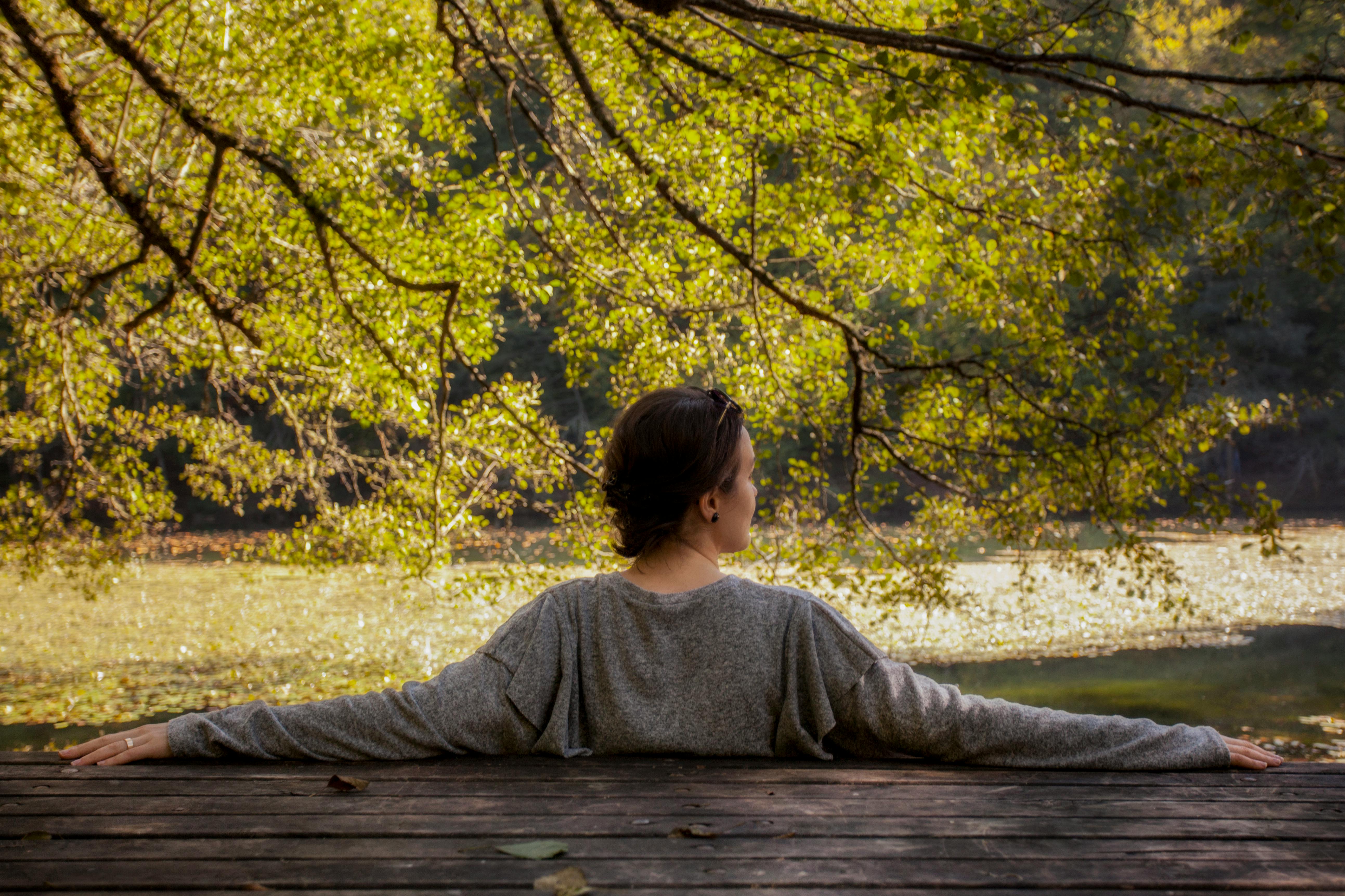Woman with Arms Spread and River behind · Free Stock Photo