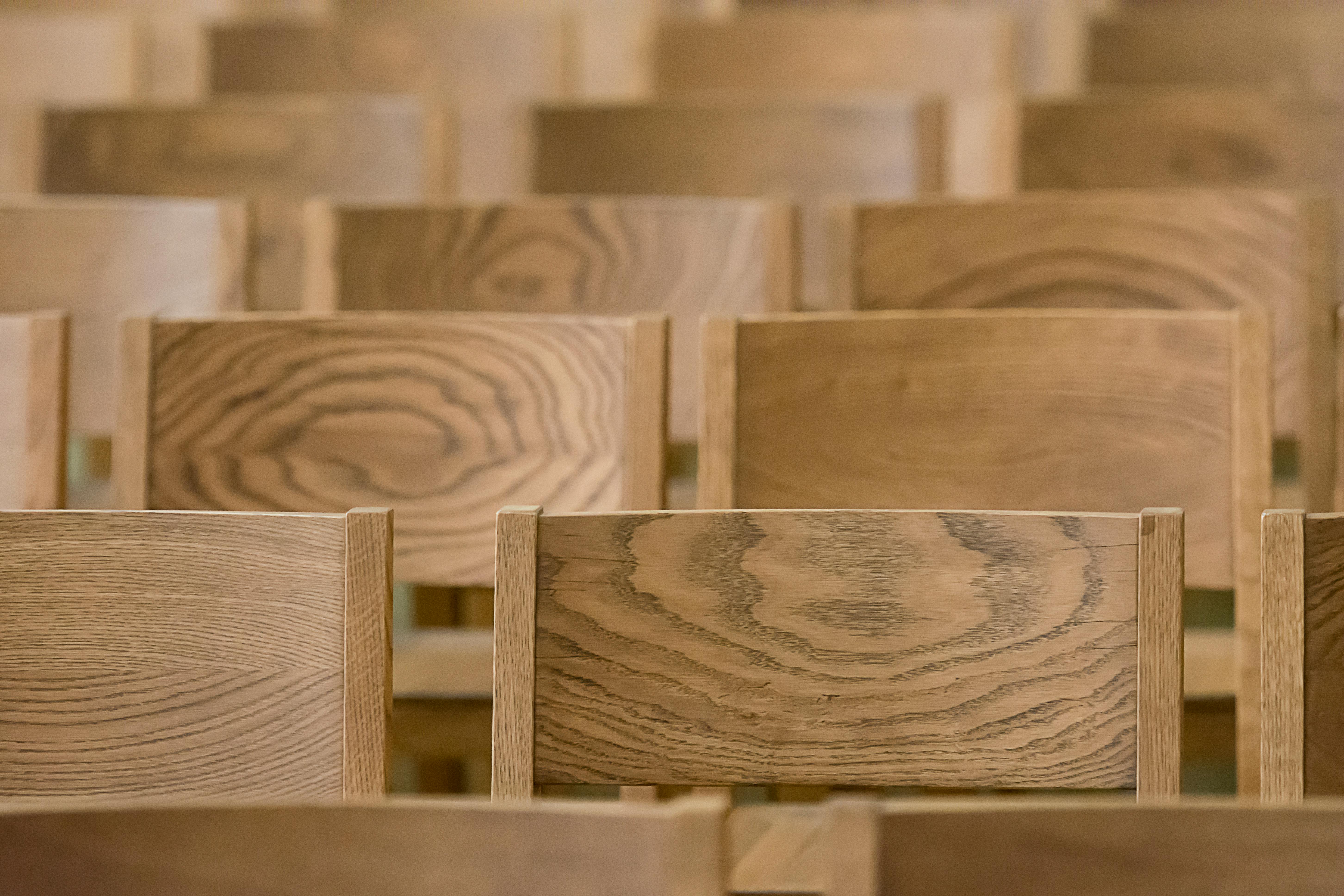 Rows of Wooden Chair Backs · Free Stock Photo