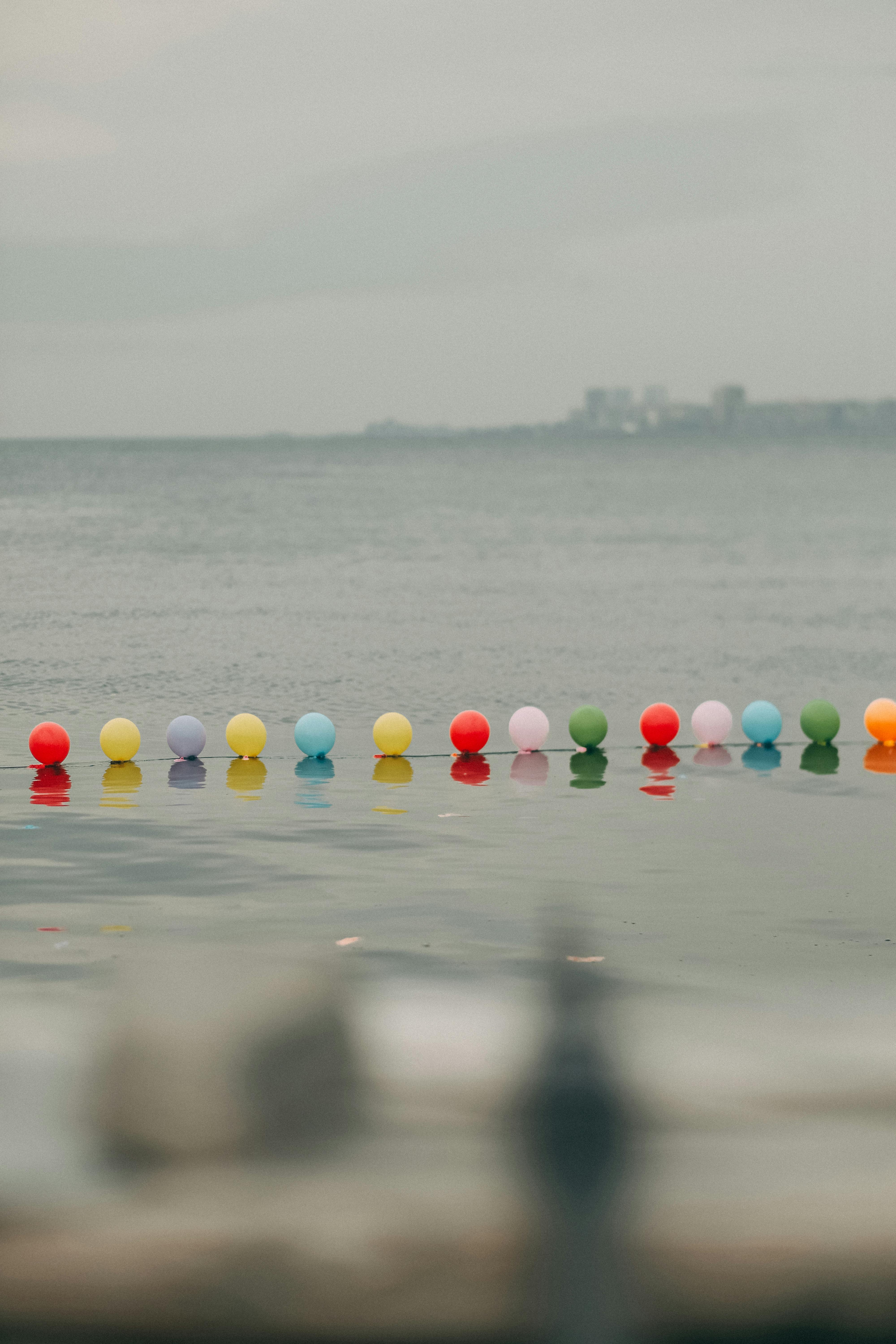 A Colorful Balloons on Water · Free Stock Photo