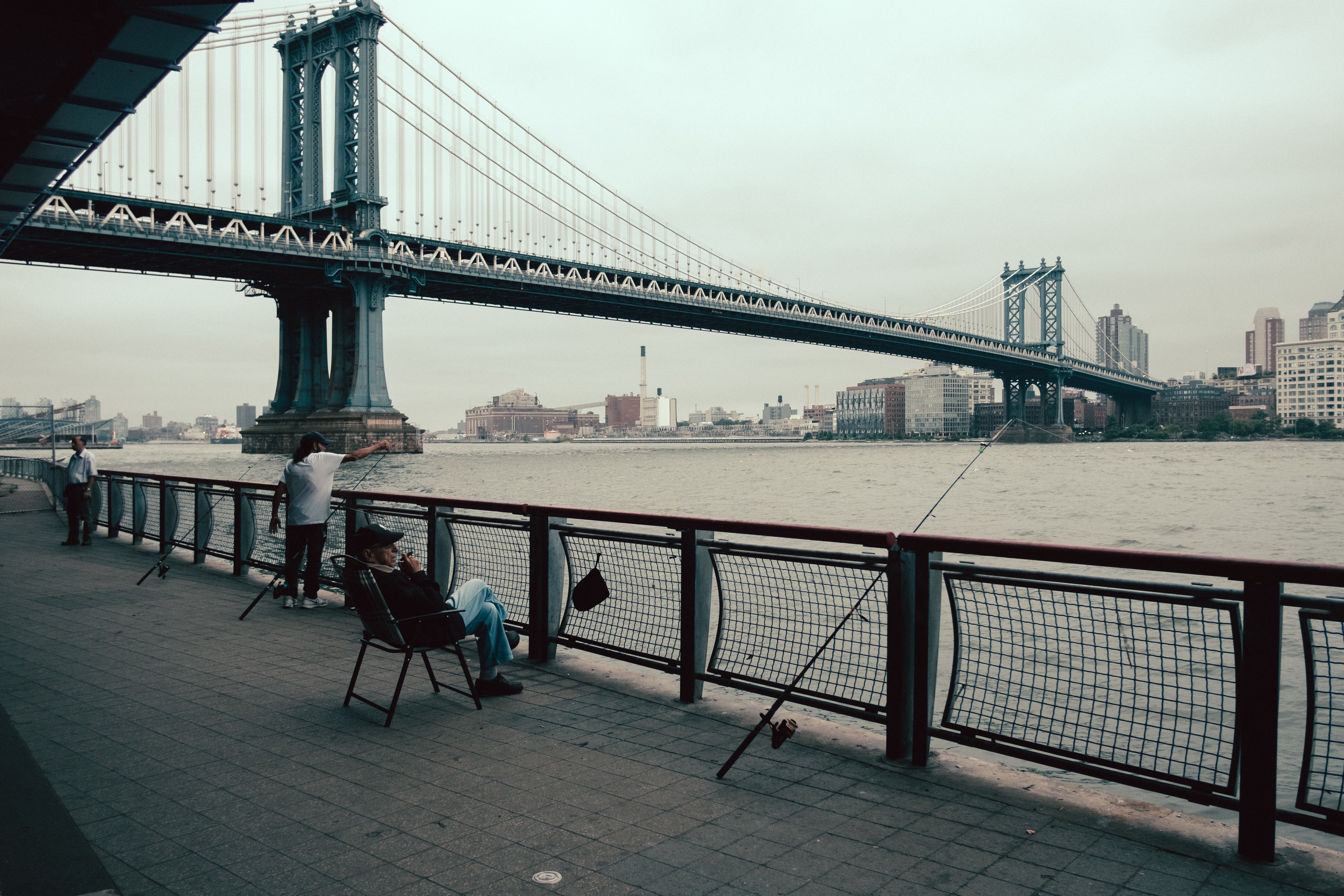 People Relaxing and Sightseeing in Front of River · Free Stock Photo