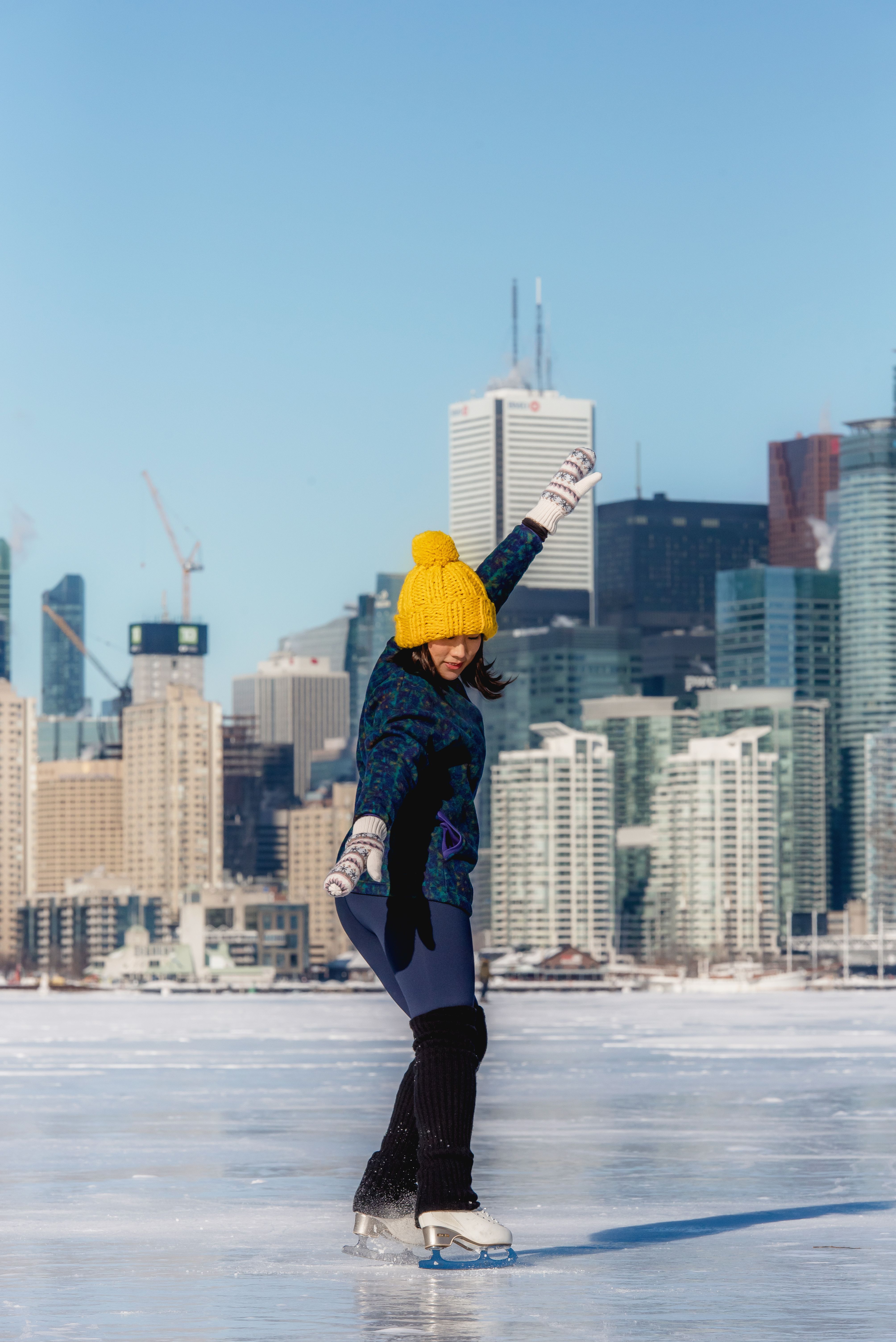 A Woman Figure Skating on the Ice Rink · Free Stock Photo
