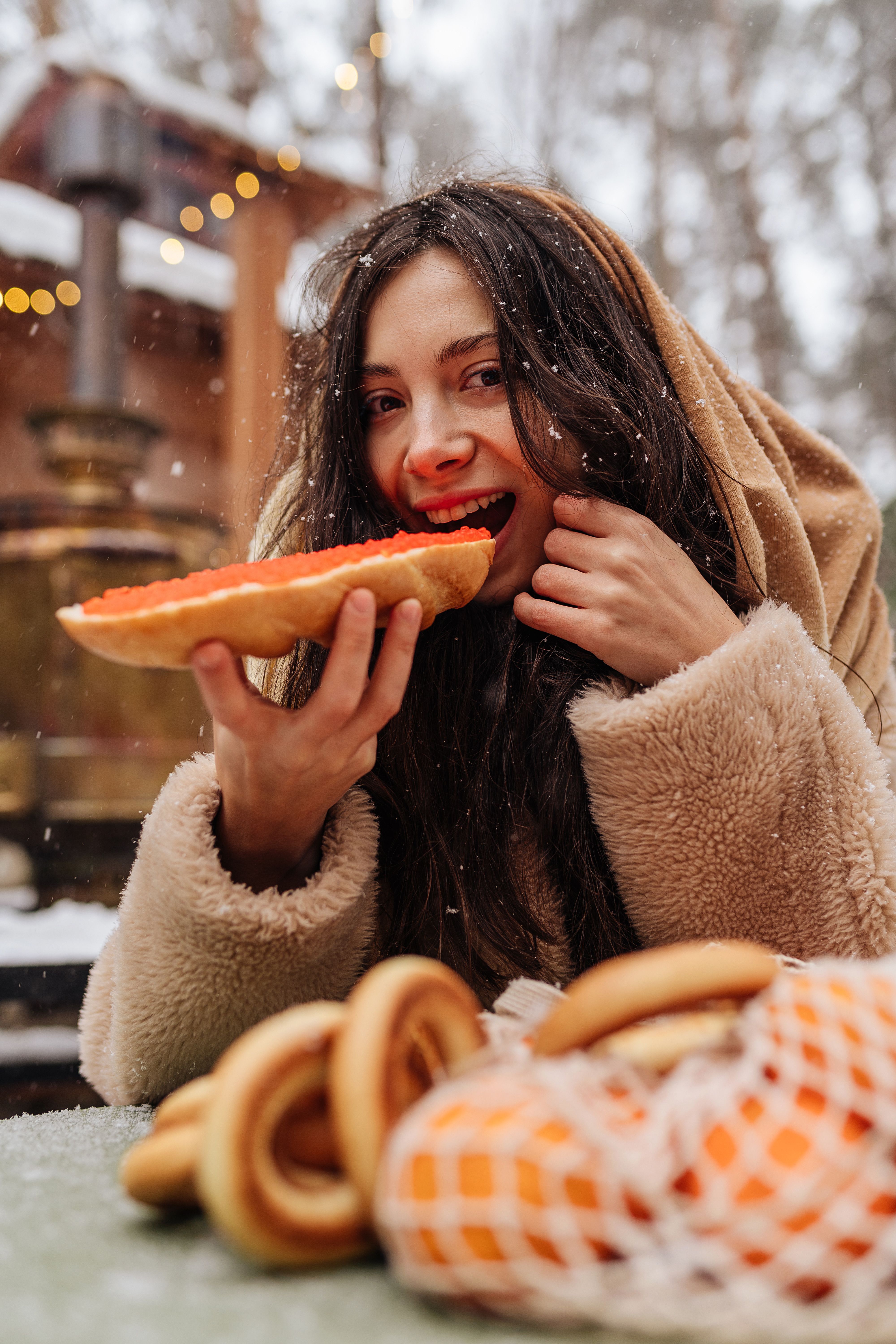Woman Wearing Warm Clothes Eating Sandwich in Snowy Weather · Free ...