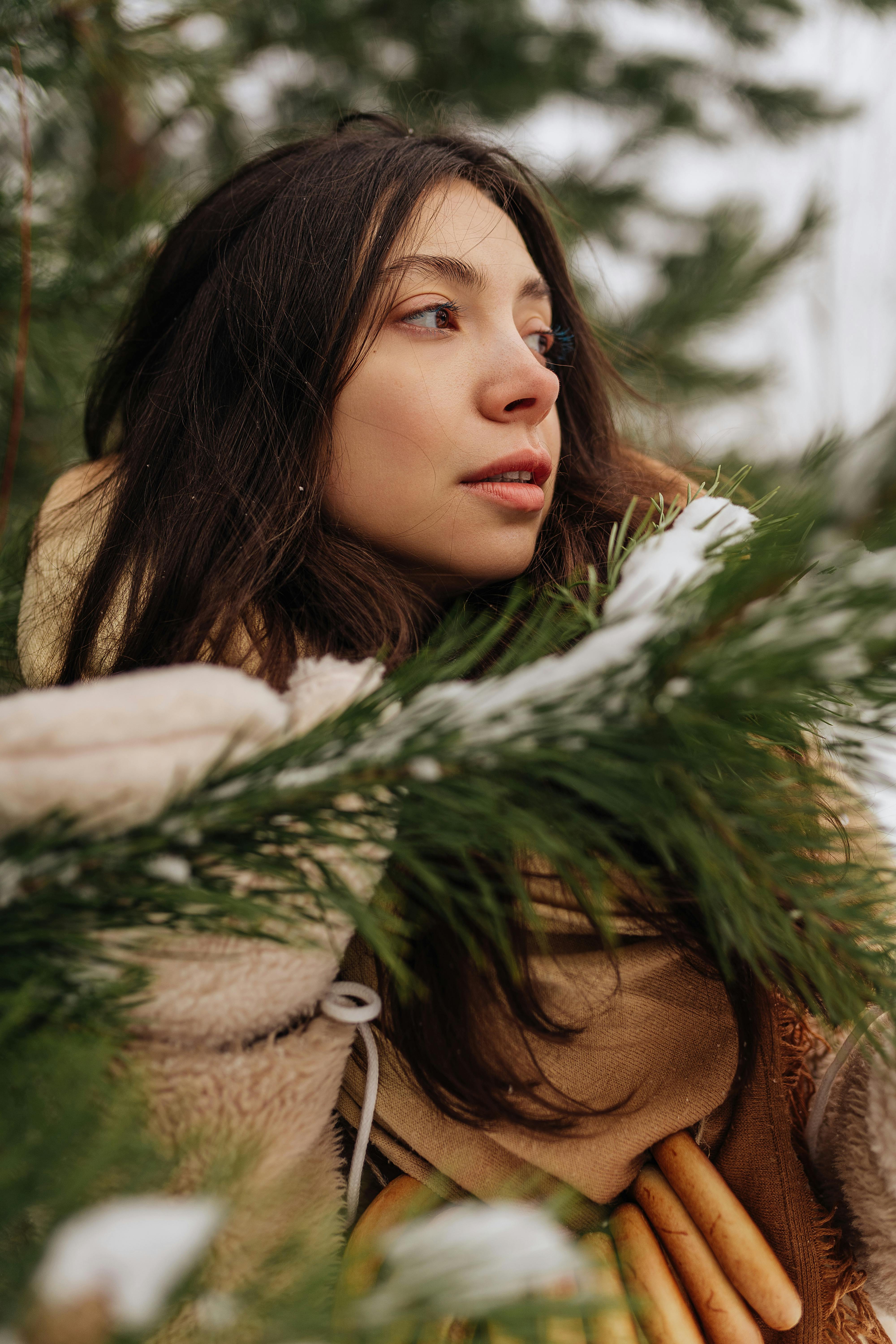 Portrait of Woman Standing Among Pine Trees · Free Stock Photo