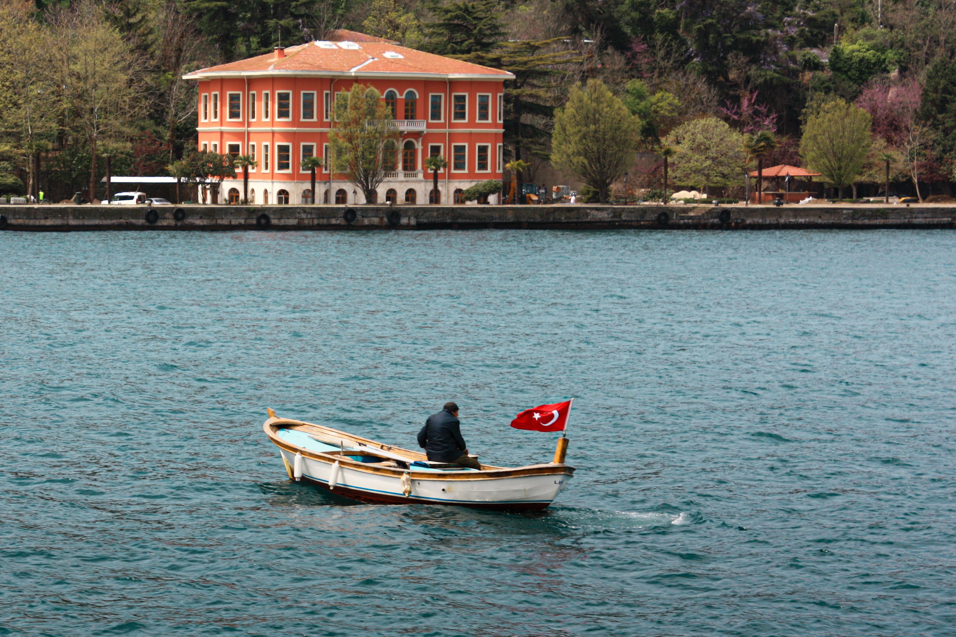 Man sitting alone on a Boat · Free Stock Photo