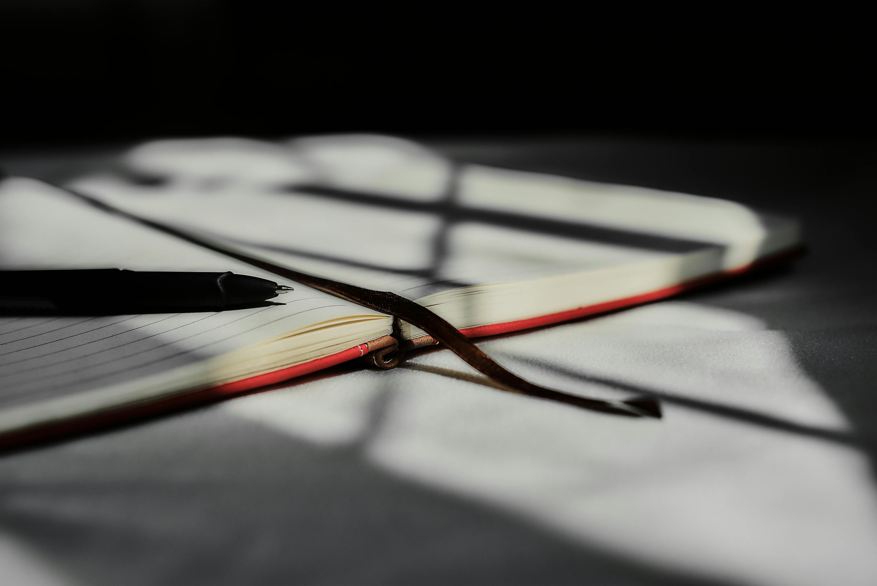 Person Writing on White Paper · Free Stock Photo