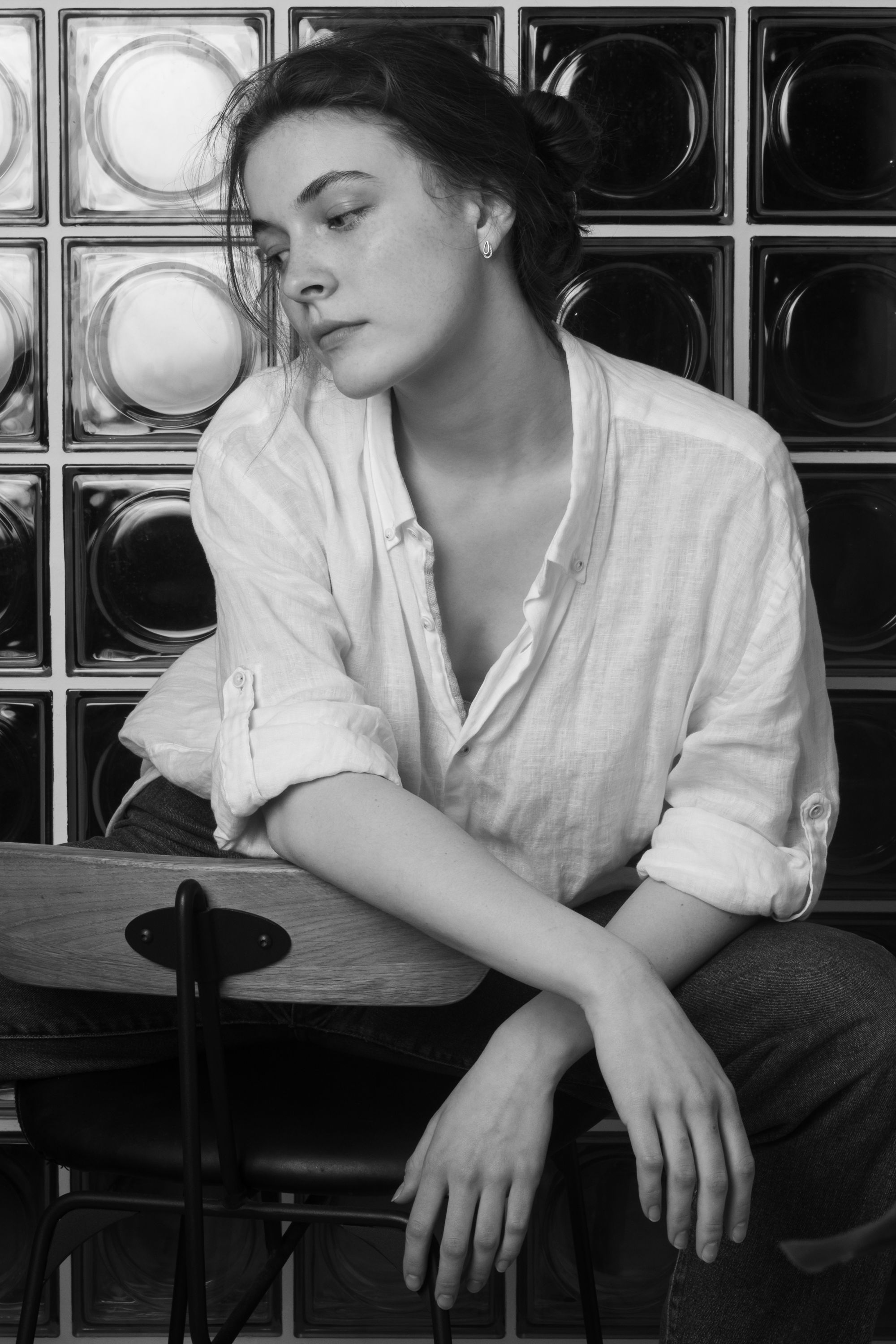 Woman in White Button Up Shirt Sitting on Chair · Free Stock Photo