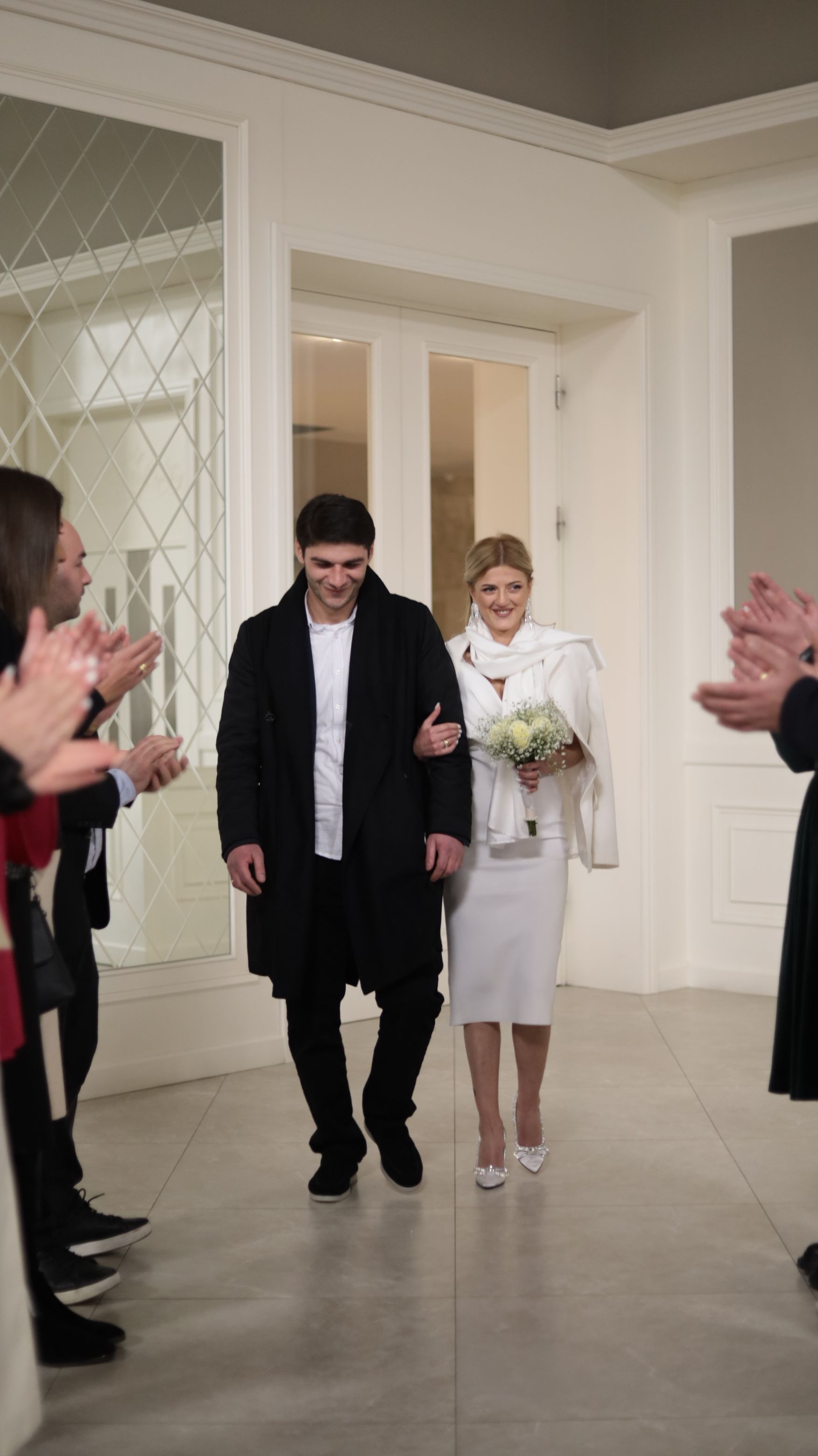 Photo of the Walking Groom and Bride and a Crowd of Wedding Guests ...