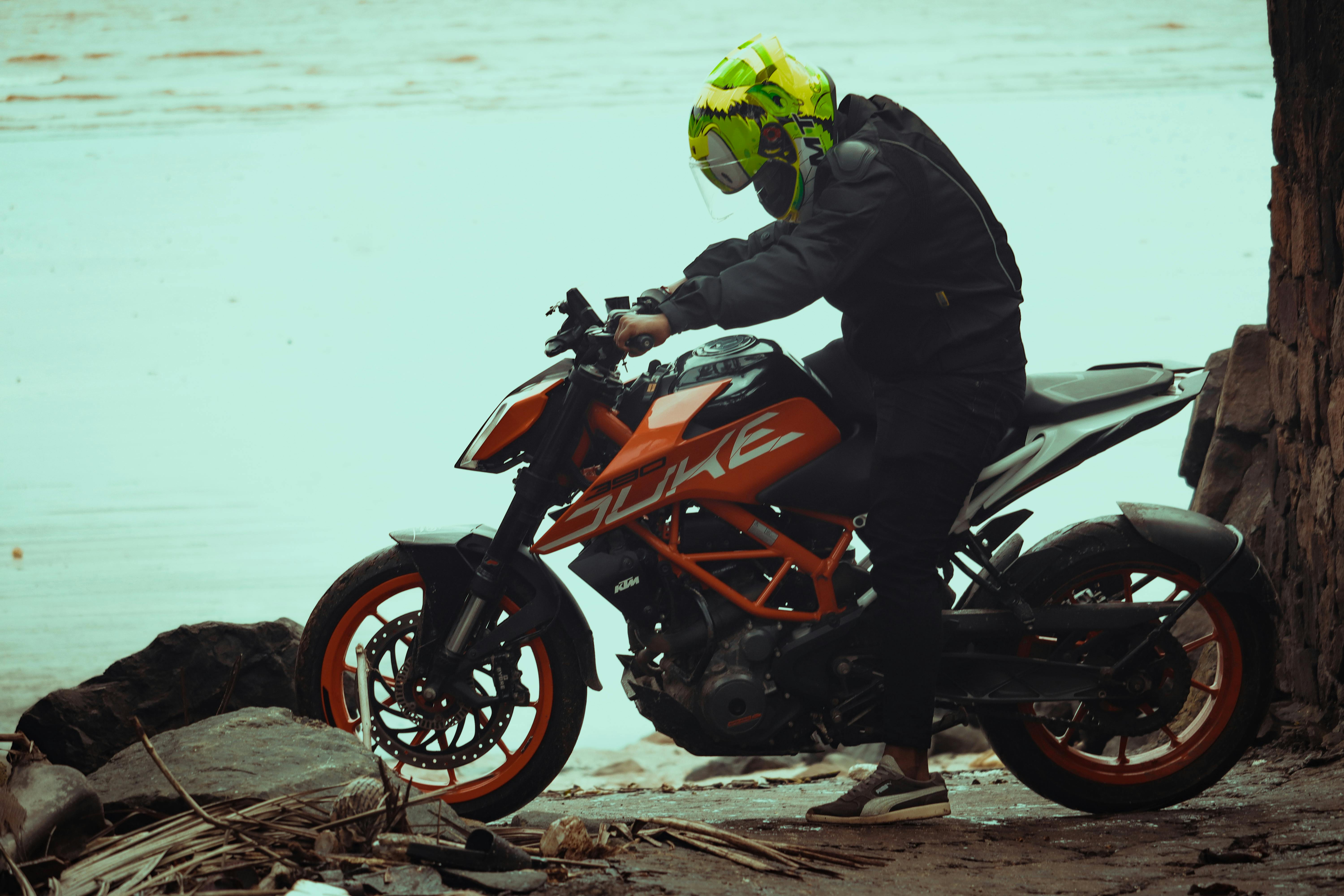 Man Looking at Motorcycle · Free Stock Photo