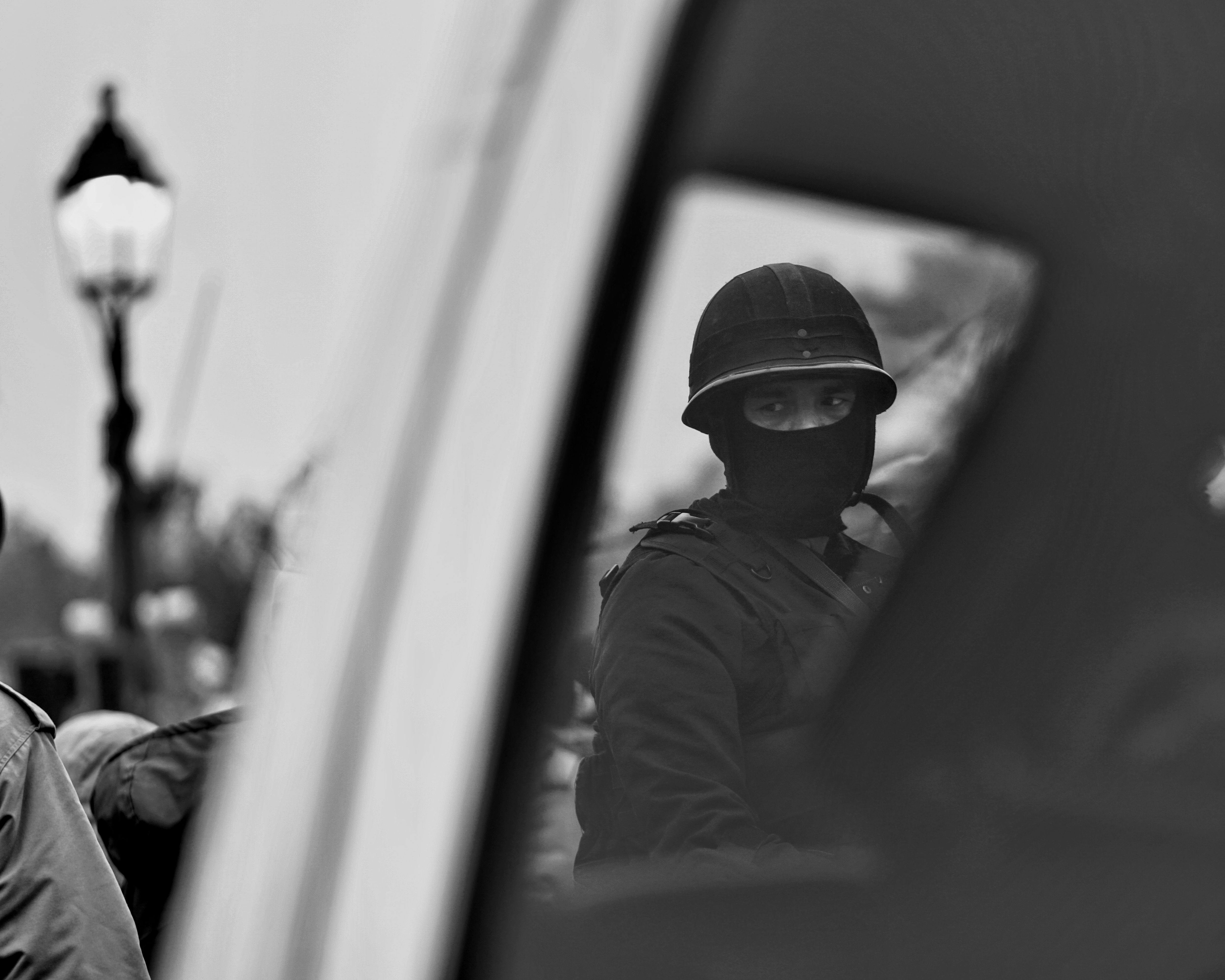 Hands Scratching a Mans Face in a Helmet · Free Stock Photo