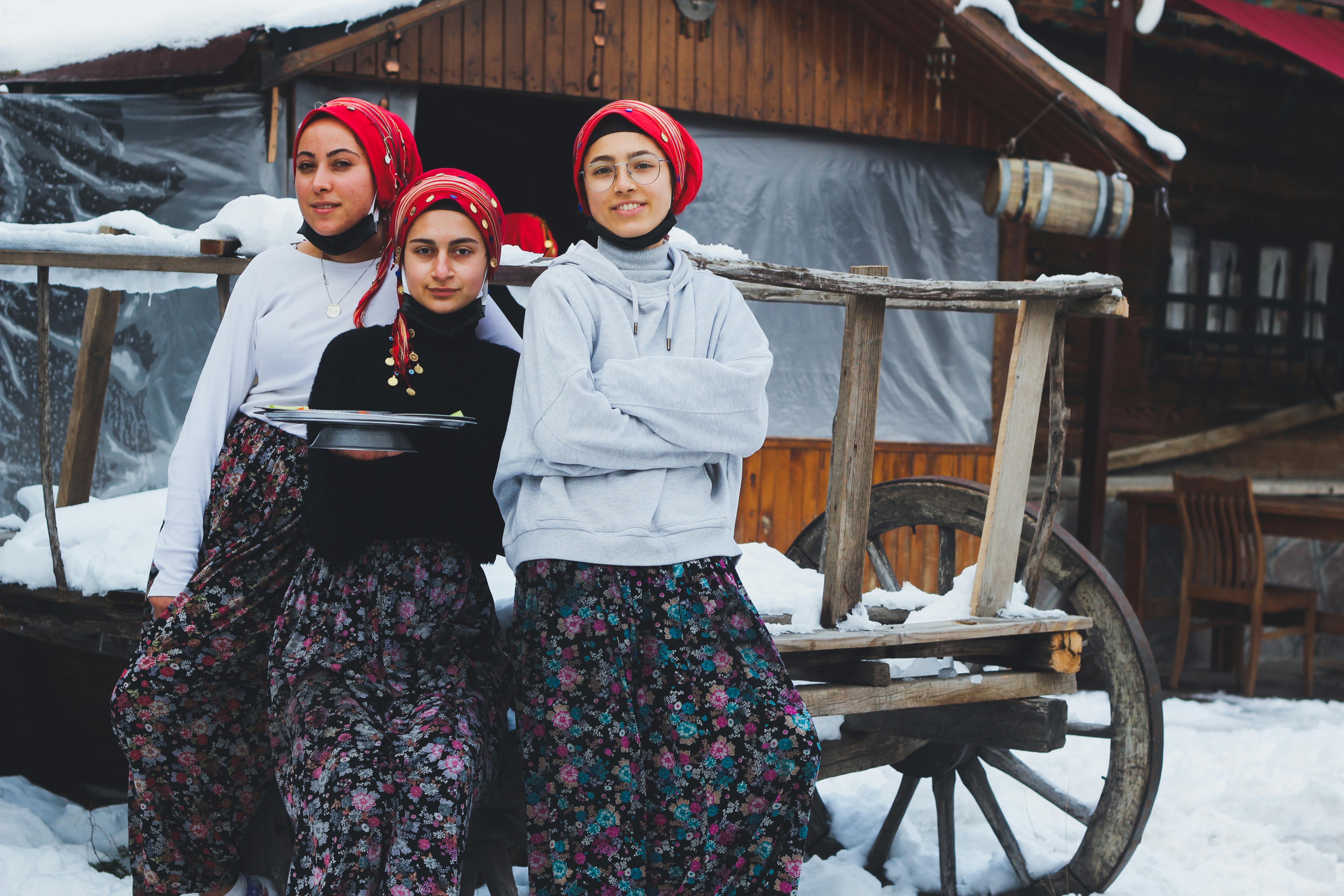 Women in Traditional Clothing in Snow · Free Stock Photo