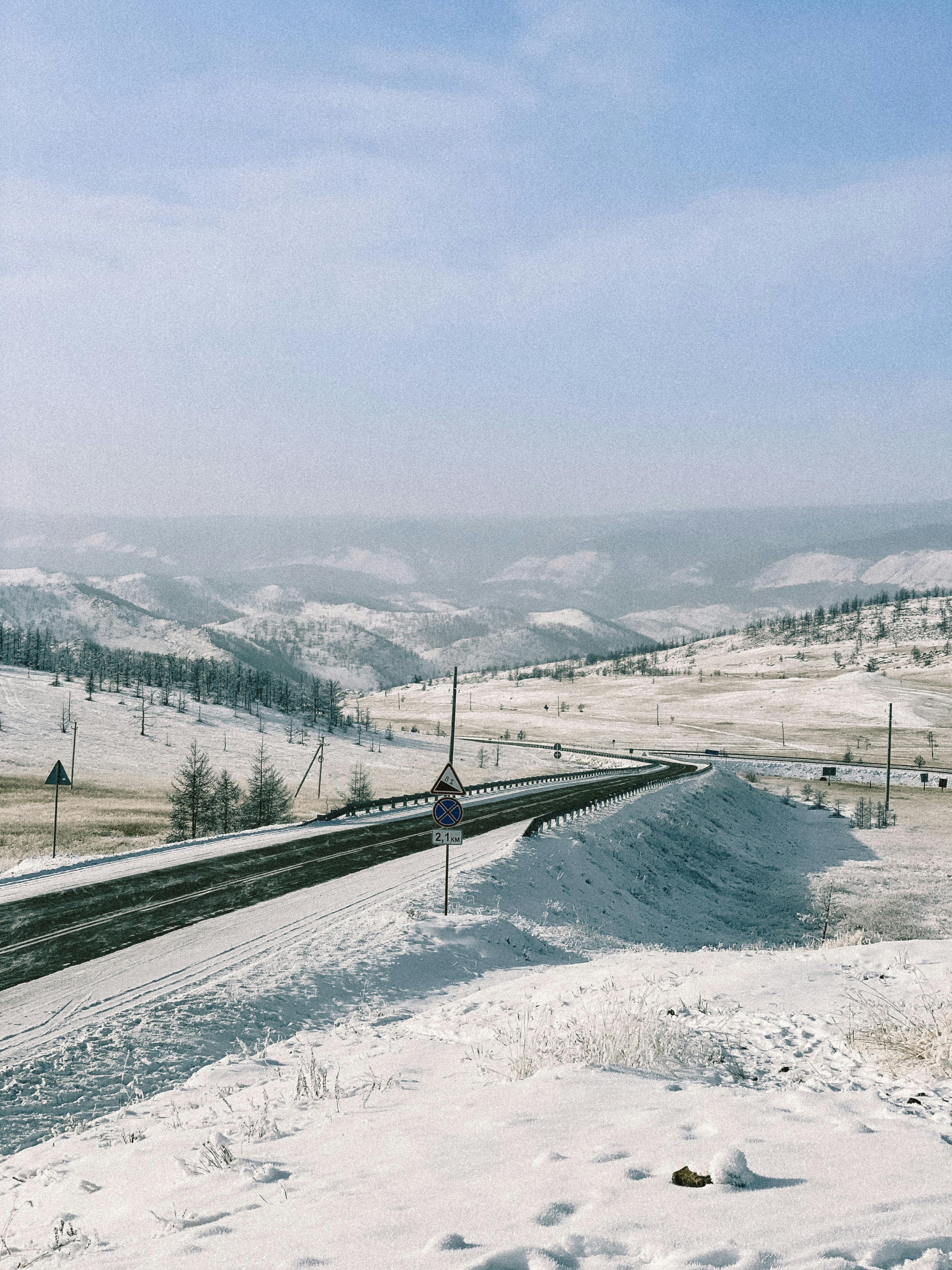 Aerial Photography Of Snowy Hill · Free Stock Photo