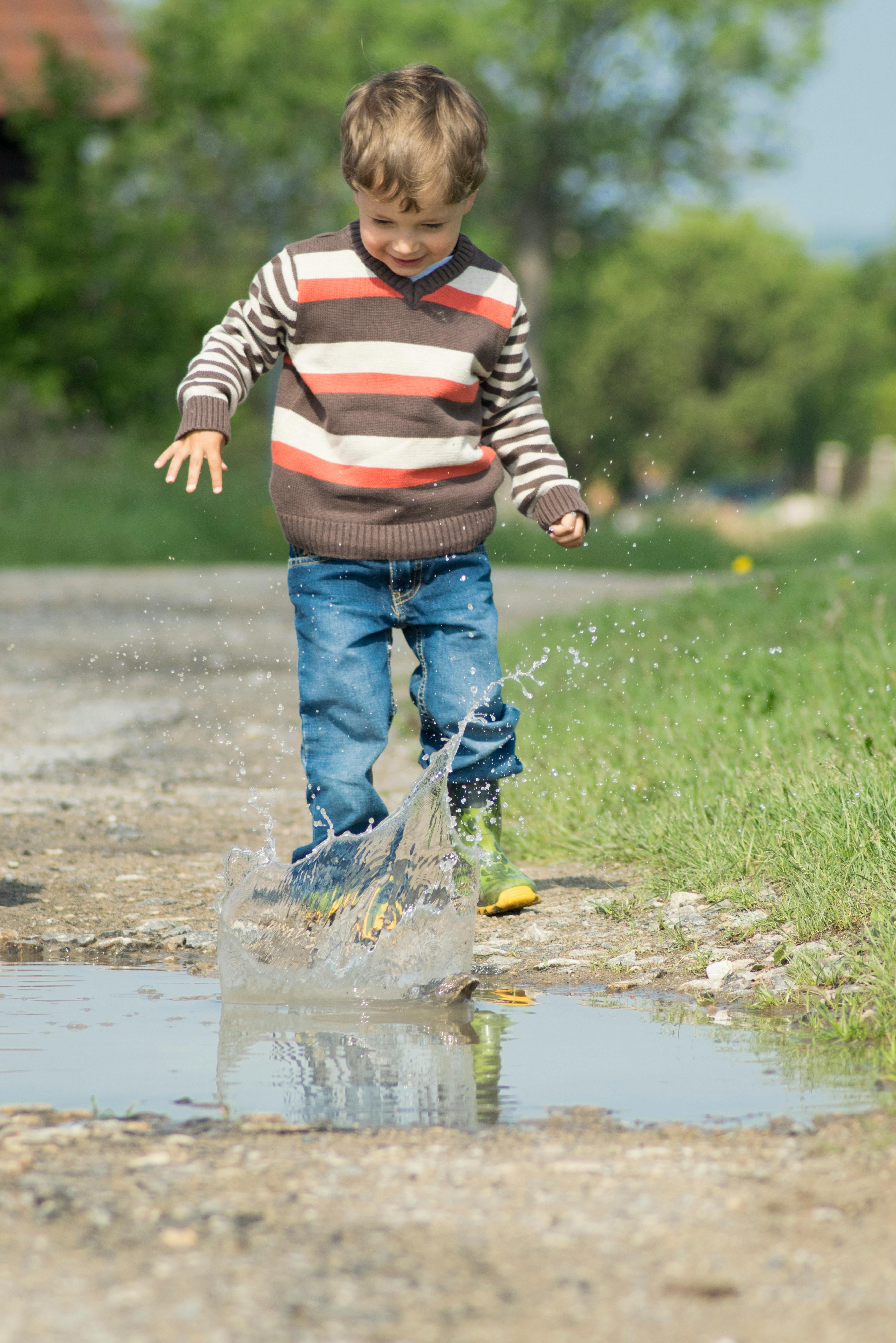 Free stock photo of little boy, puddle, water