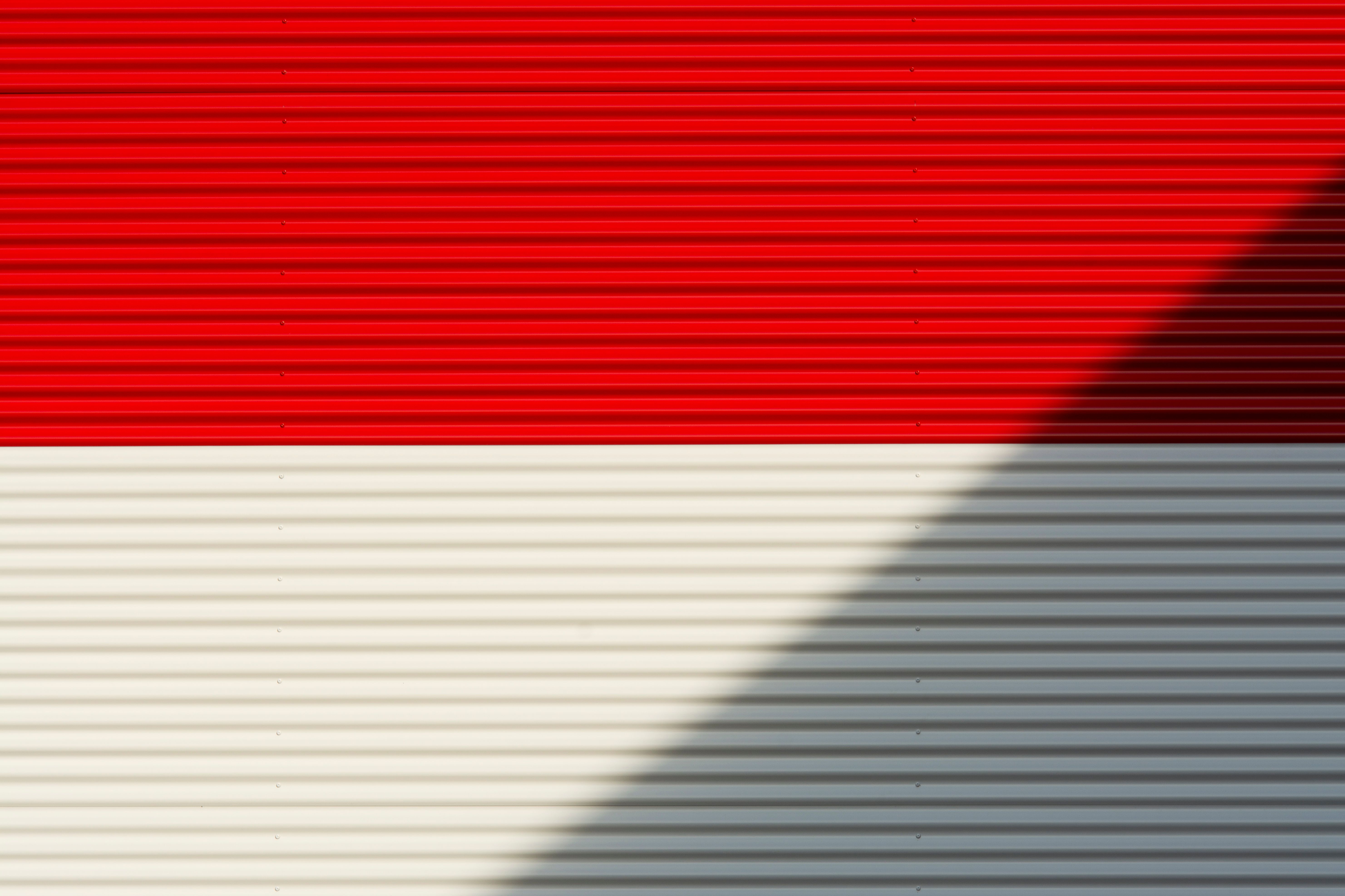 Shadow on Red and White Metal Wall · Free Stock Photo