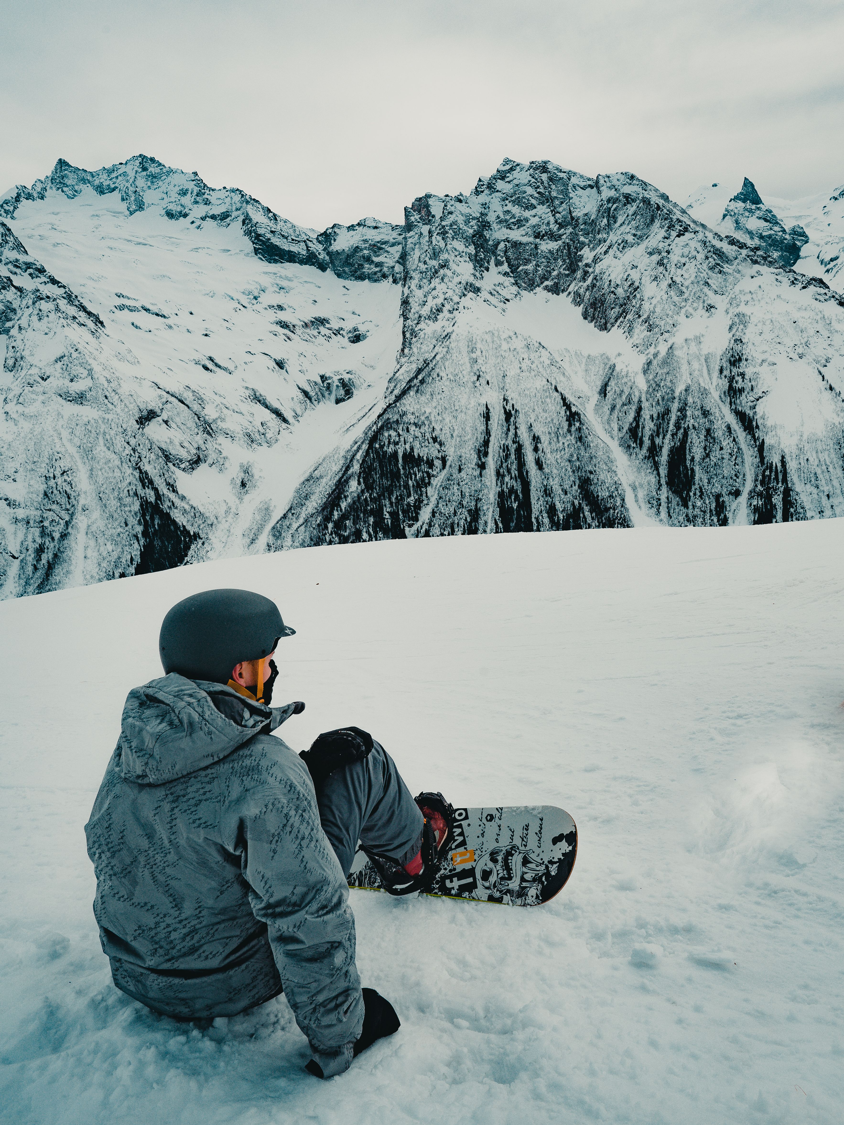 A Man Sitting on the Snow · Free Stock Photo