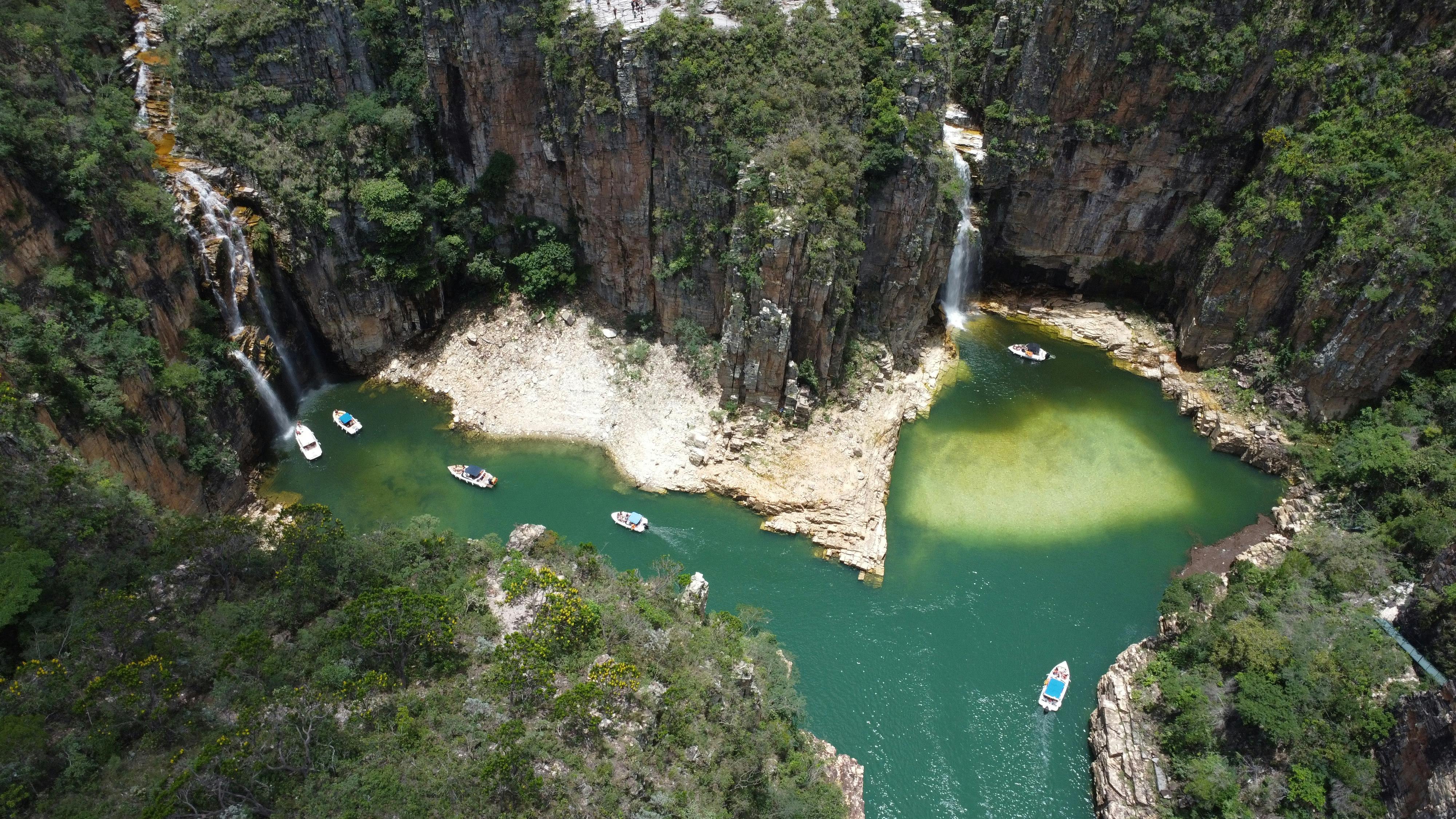 Aerial Photography of a Lagoon Surrounded by Rock Formations · Free ...