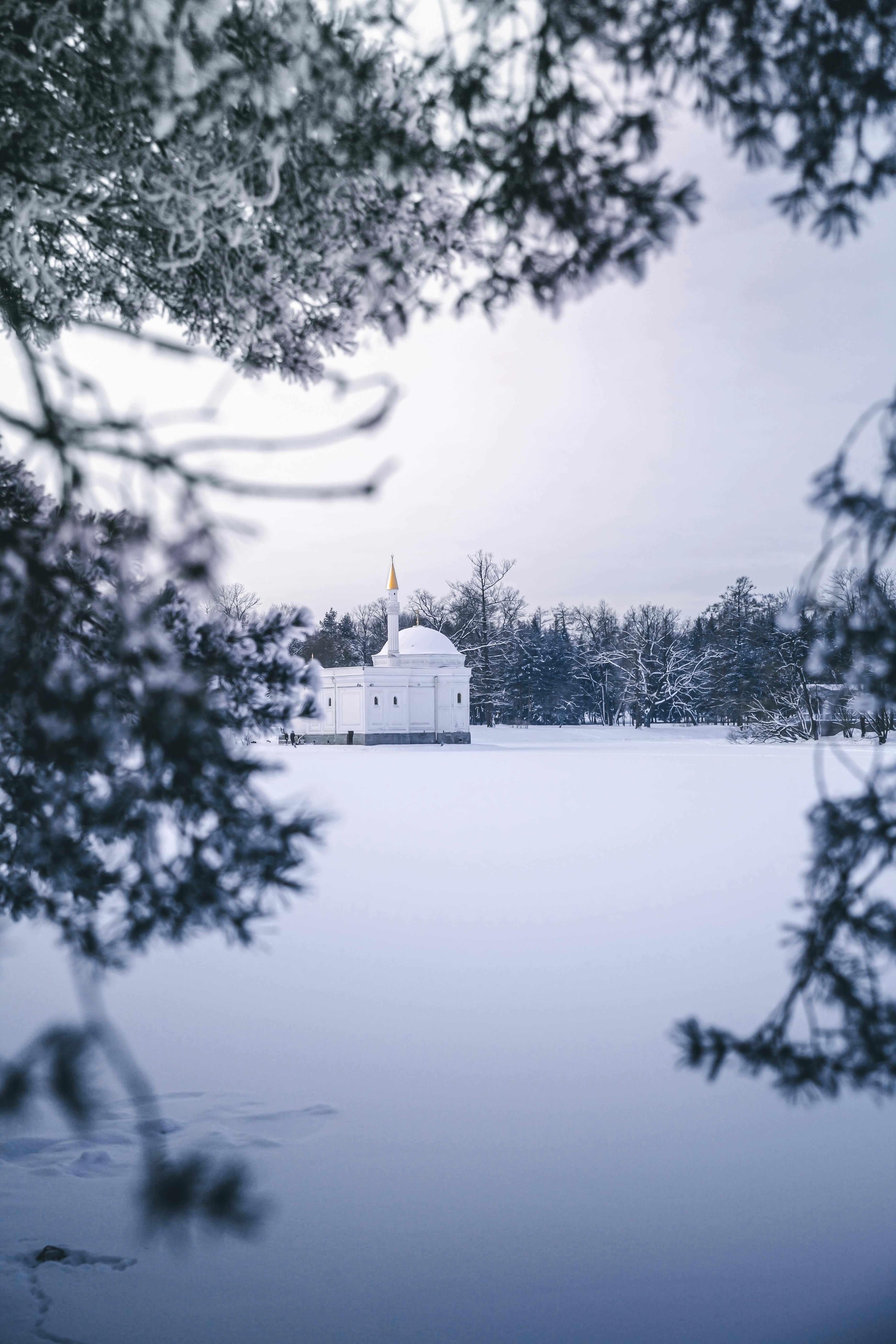 A White Mosque on Snow Covered Ground during Winter · Free Stock Photo